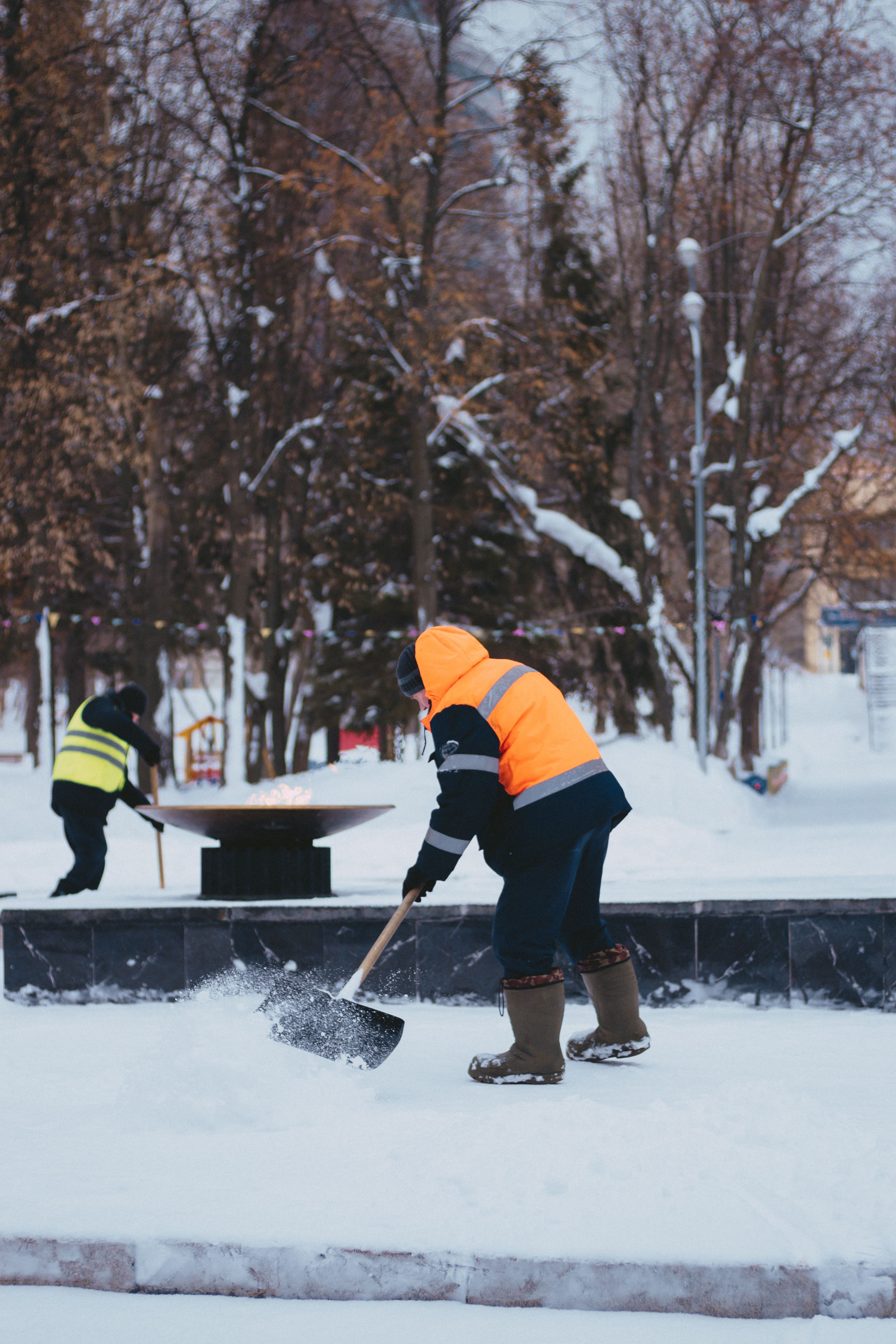 Close-up of Person Shoveling Snow Outdoors · Free Stock Photo