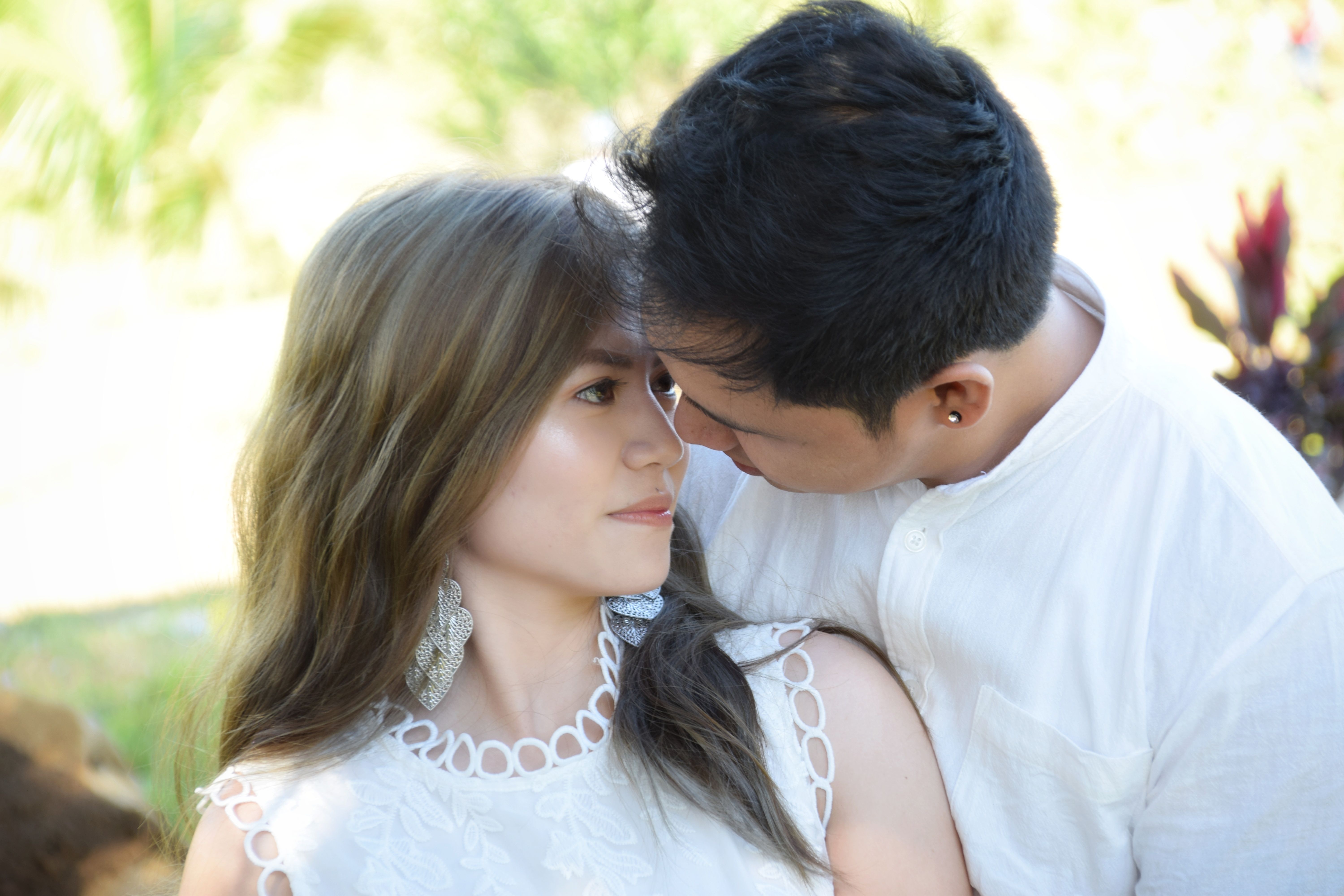 Man and Woman Standing Smiling Face to Face Together Close-Up Photo ...