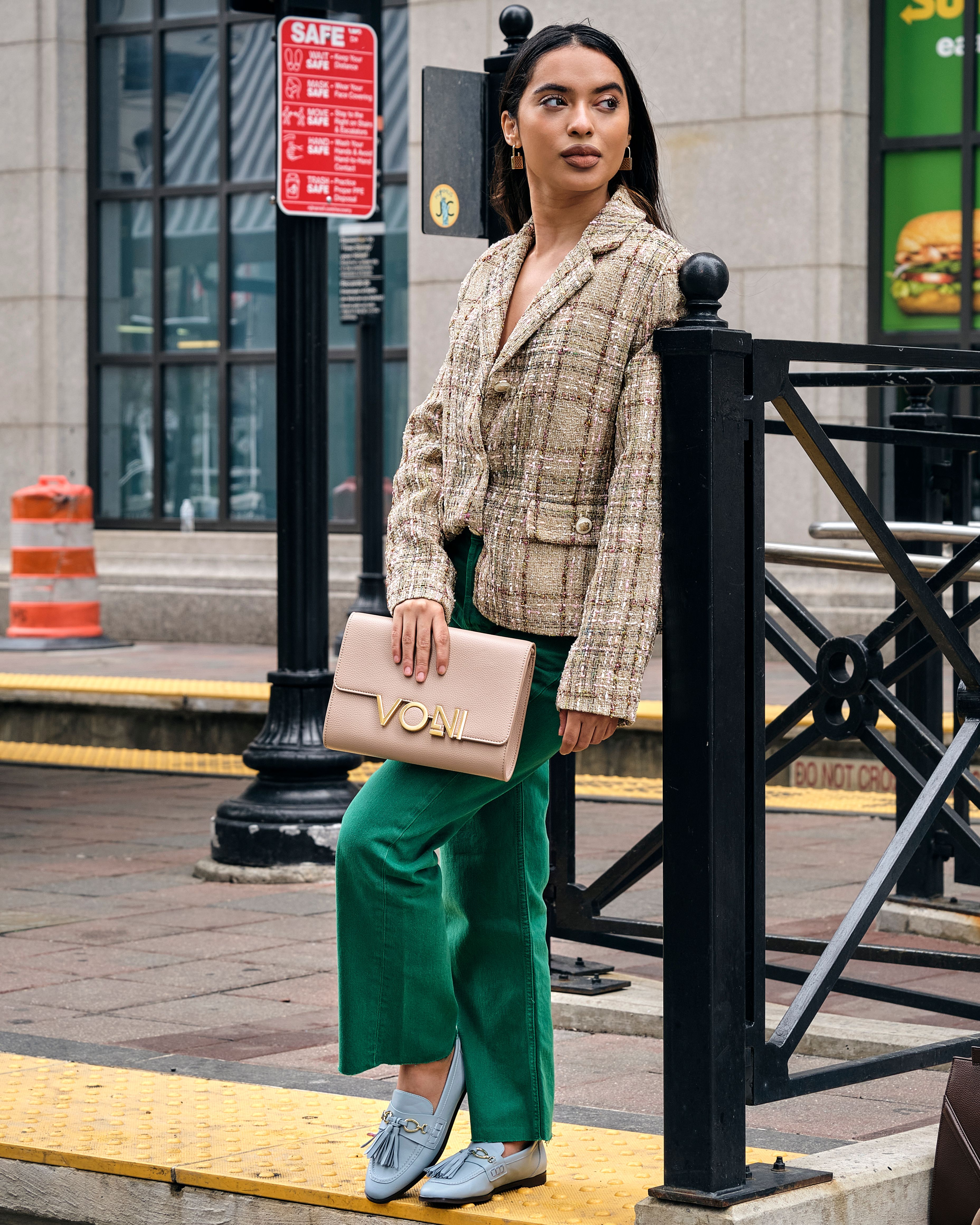Fashionable Woman Holding her Bag While on the Street · Free Stock Photo