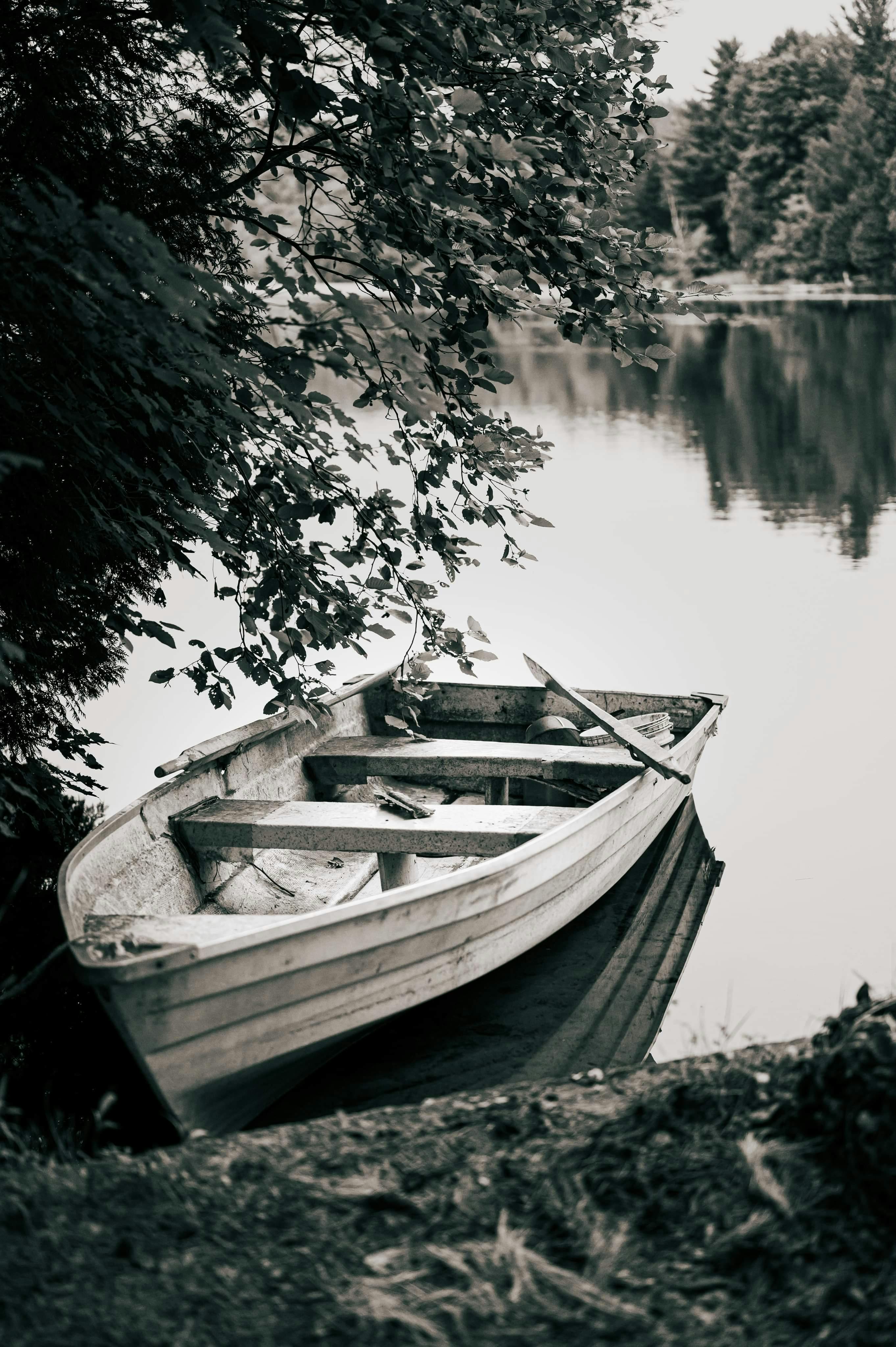Grayscale Photo of Boat Docked on Lake · Free Stock Photo