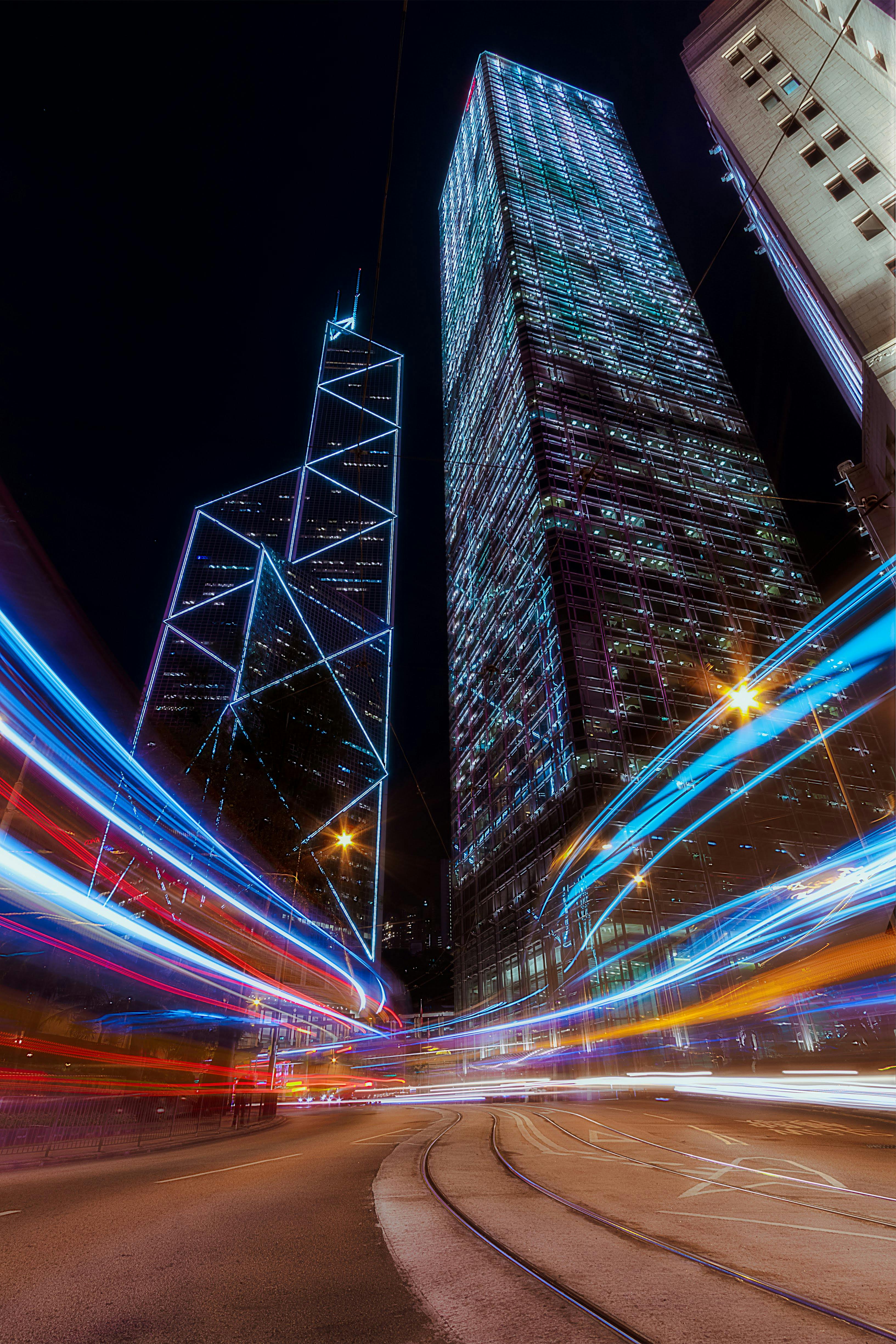 A Low Angle Shot of Skyscrapers at Night · Free Stock Photo