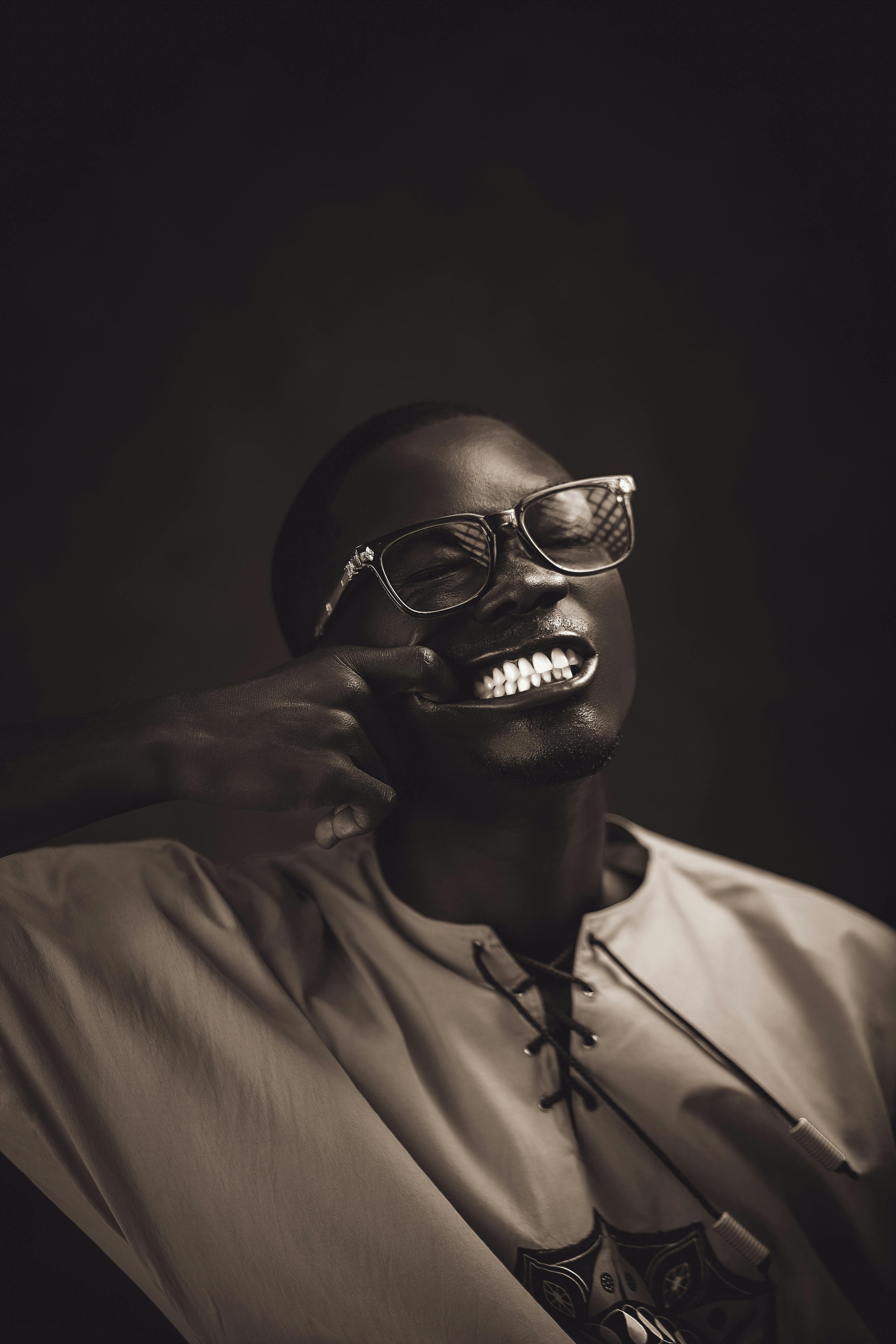 Back of a Man Pulling his T-Shirt up · Free Stock Photo