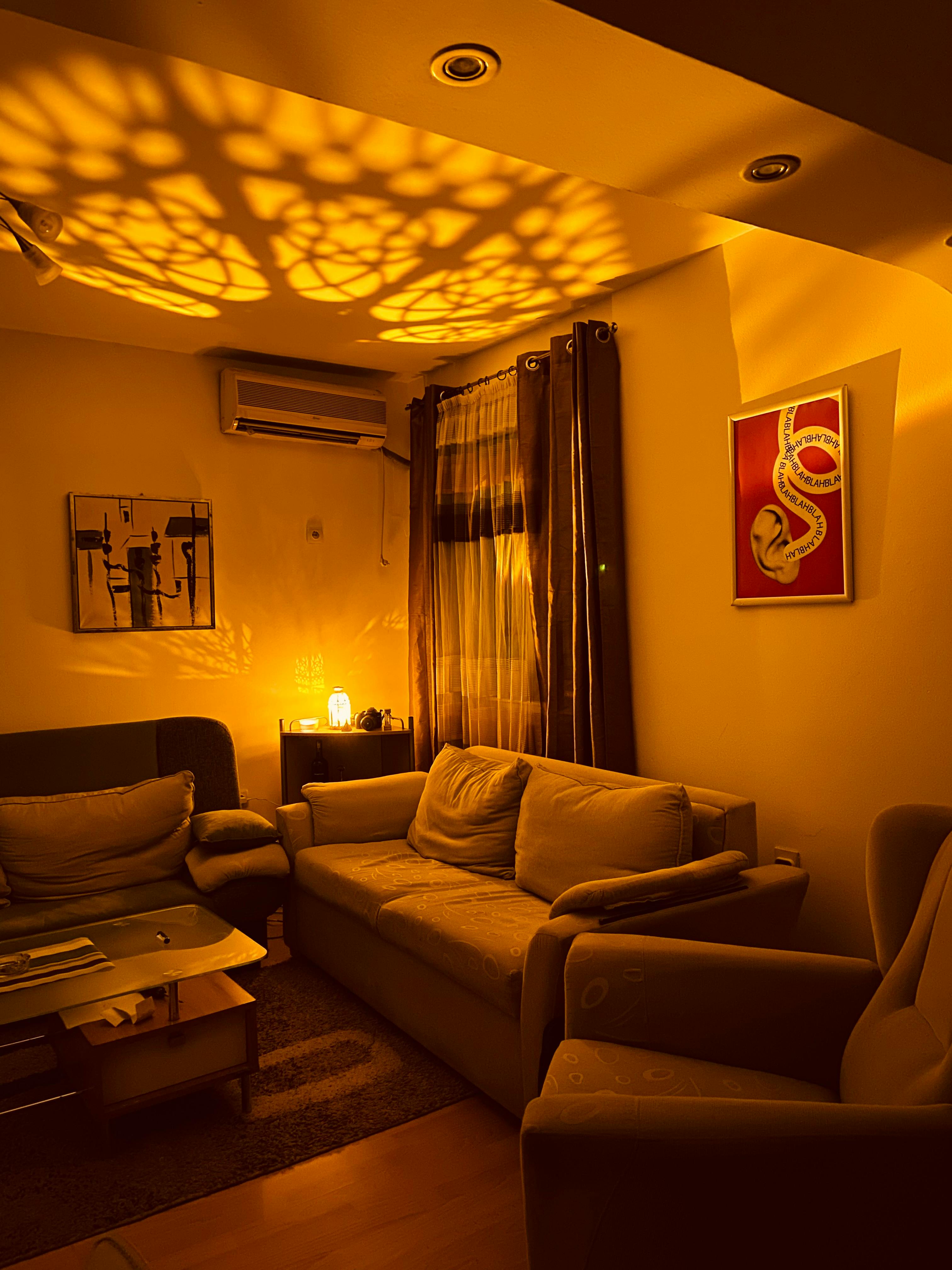 Lamp Illuminating Orange Light in a Living Room · Free Stock Photo