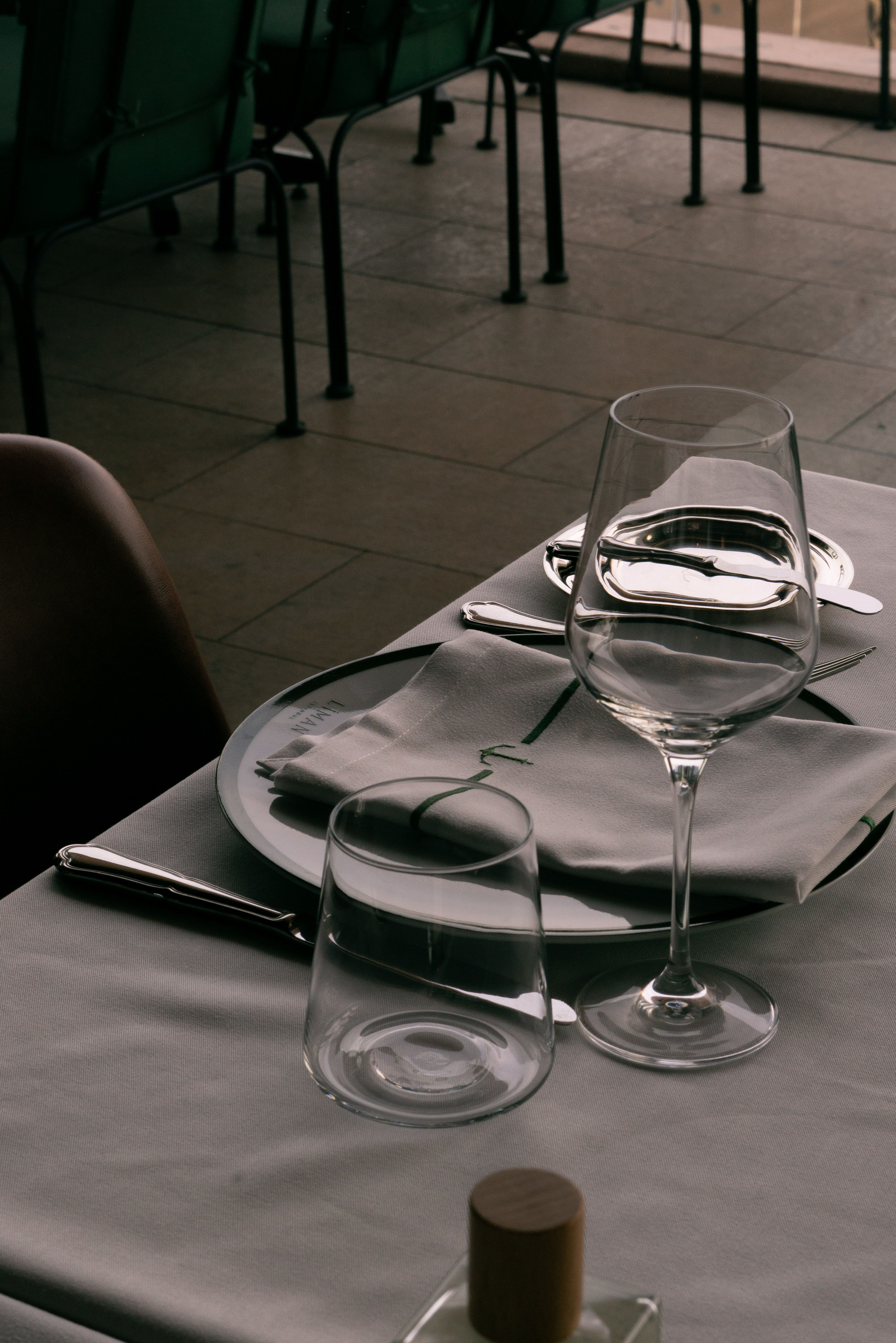 Plates and Drinking Glasses on Restaurant Table · Free Stock Photo
