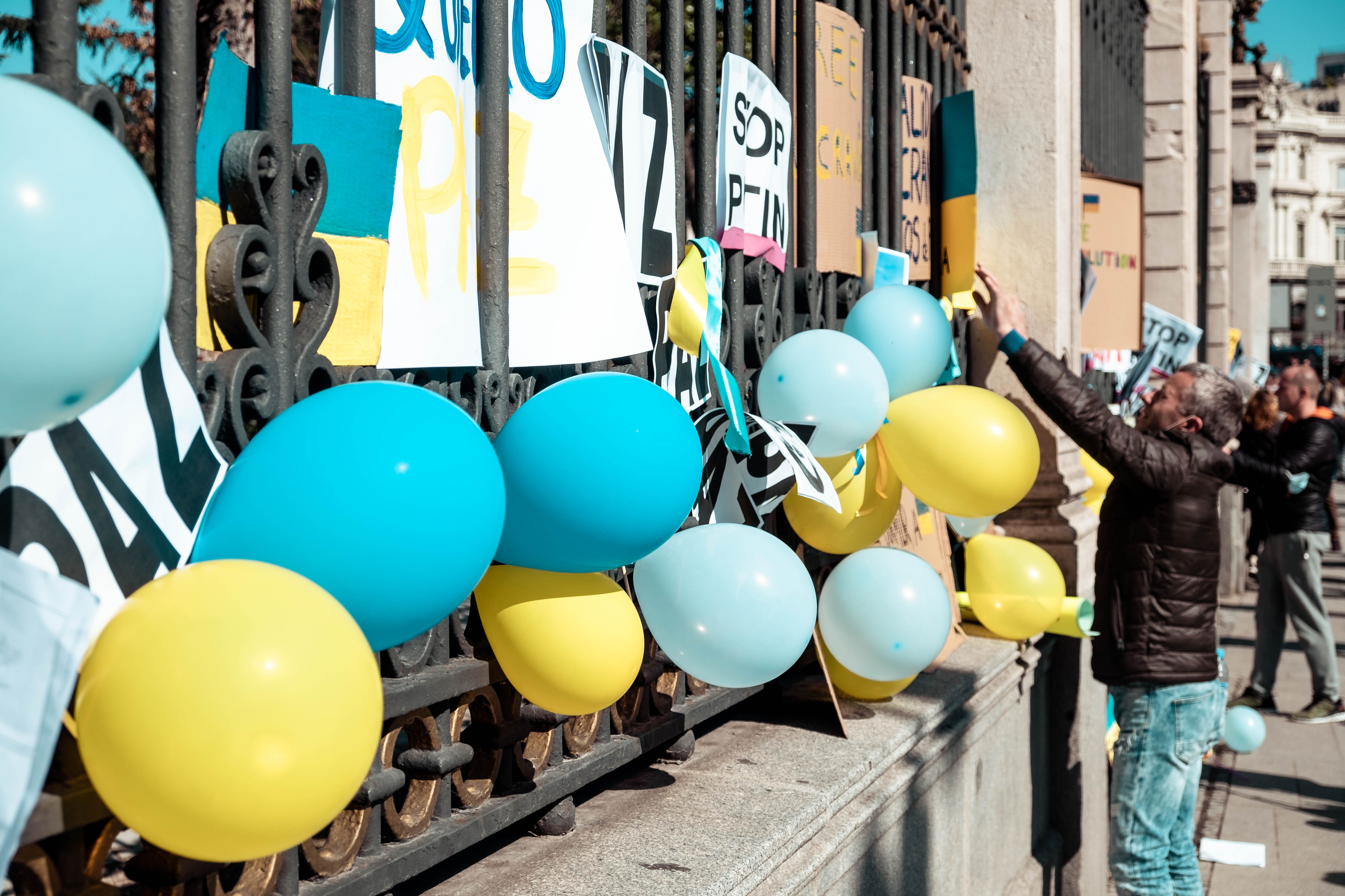 People Holding Banners Standing Beside Each Other · Free Stock Photo