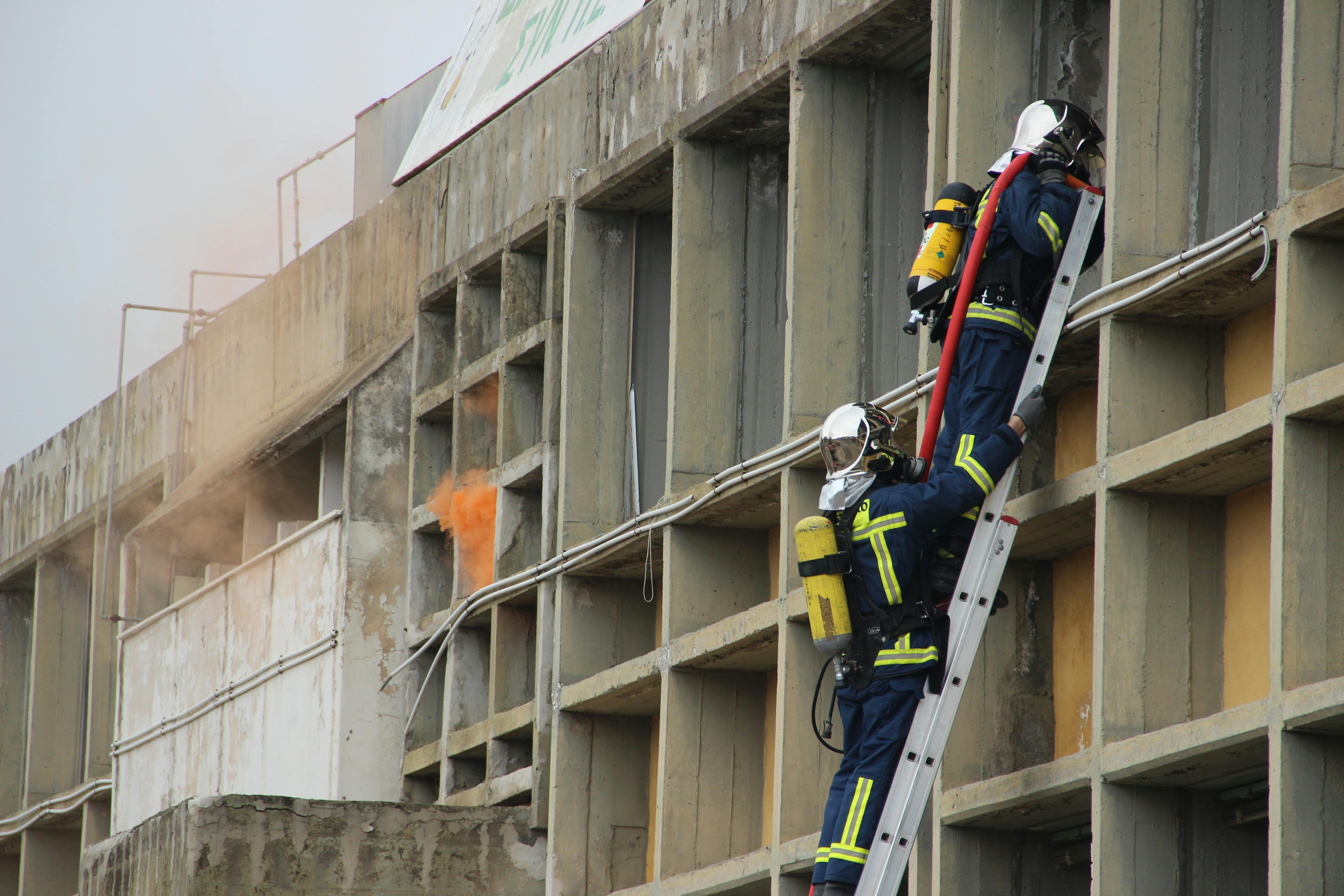 Firefighters on a Metal Ladder · Free Stock Photo
