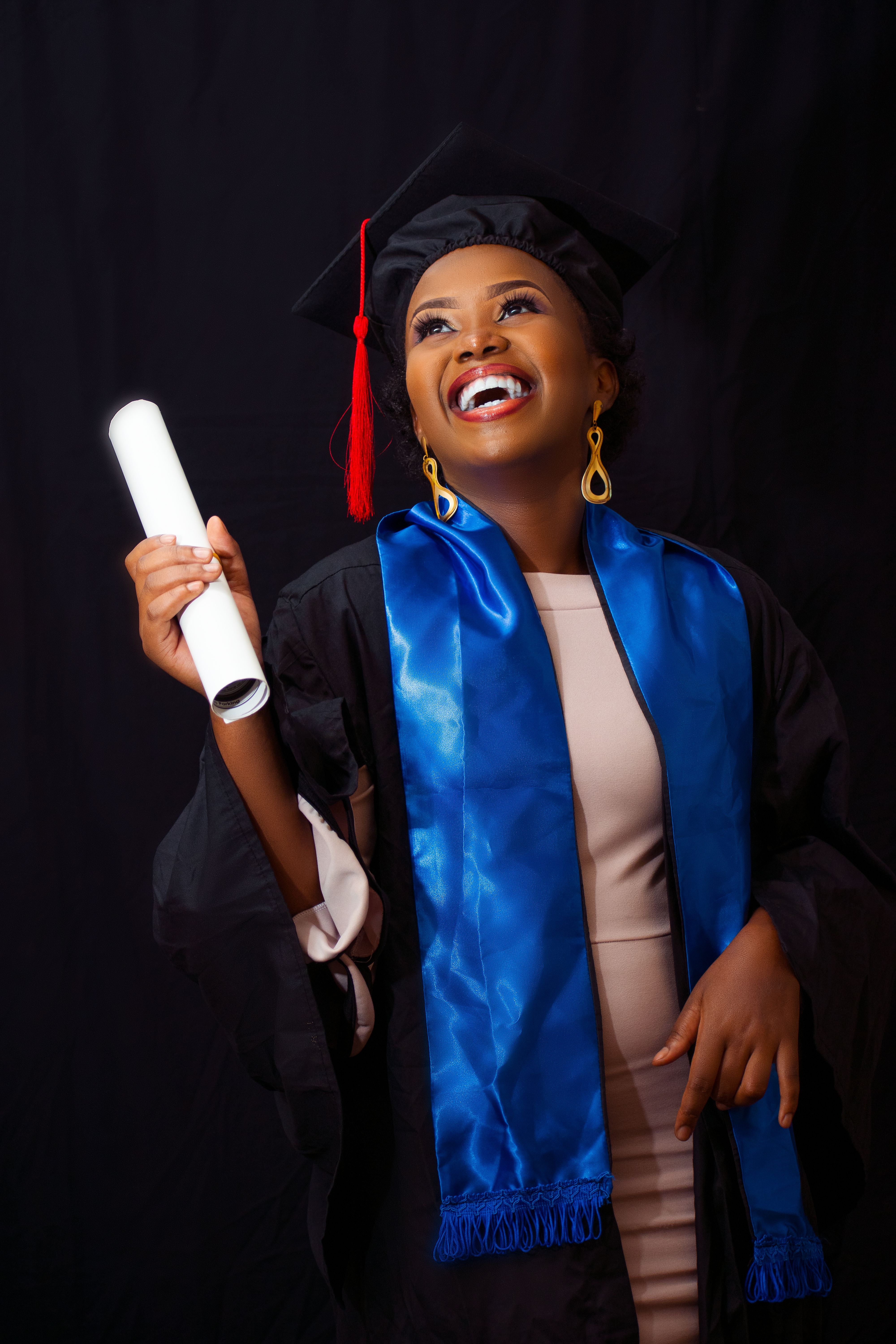 Happy Woman Wearing Graduation Biretta · Free Stock Photo
