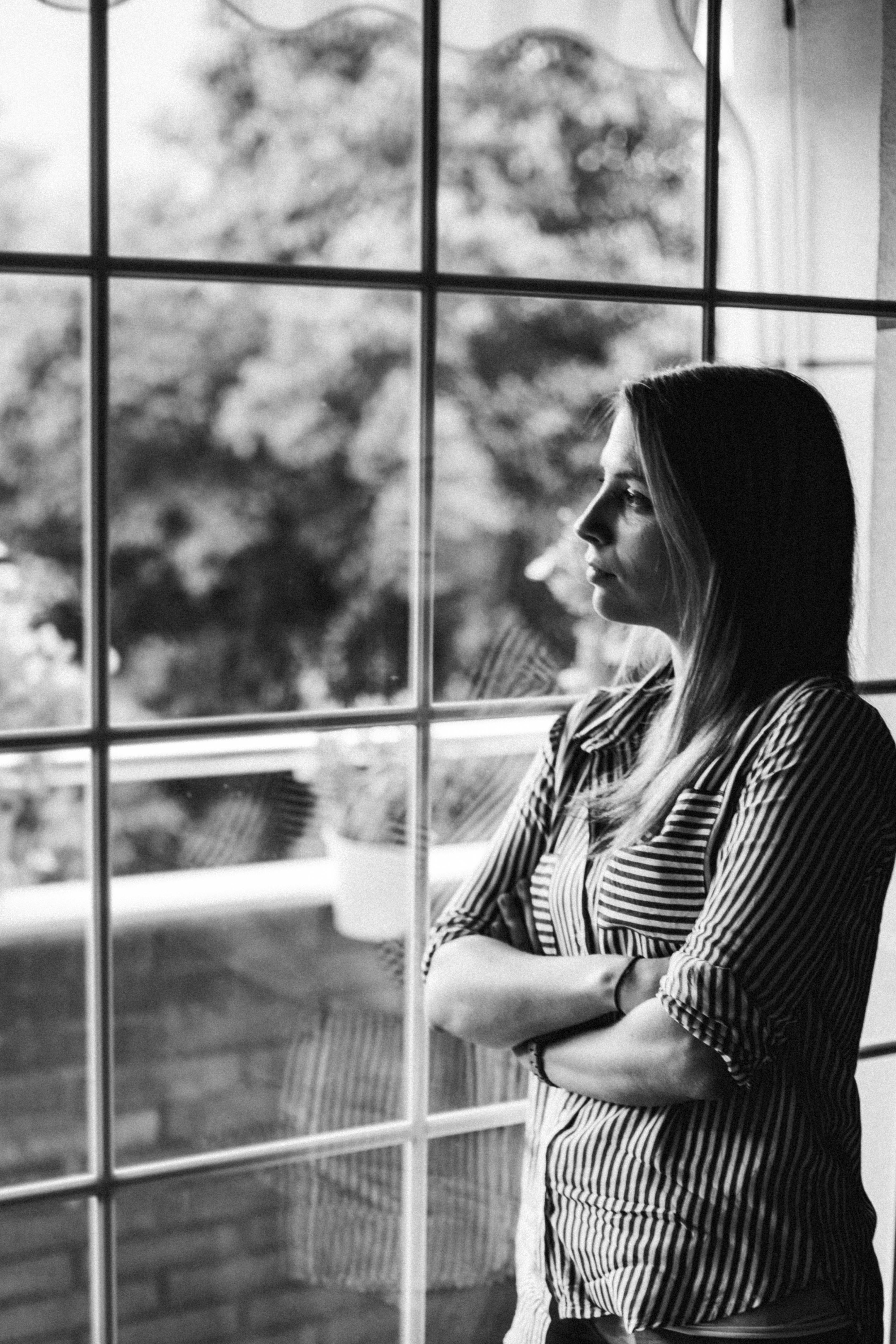 Woman Looking At The Window · Free Stock Photo