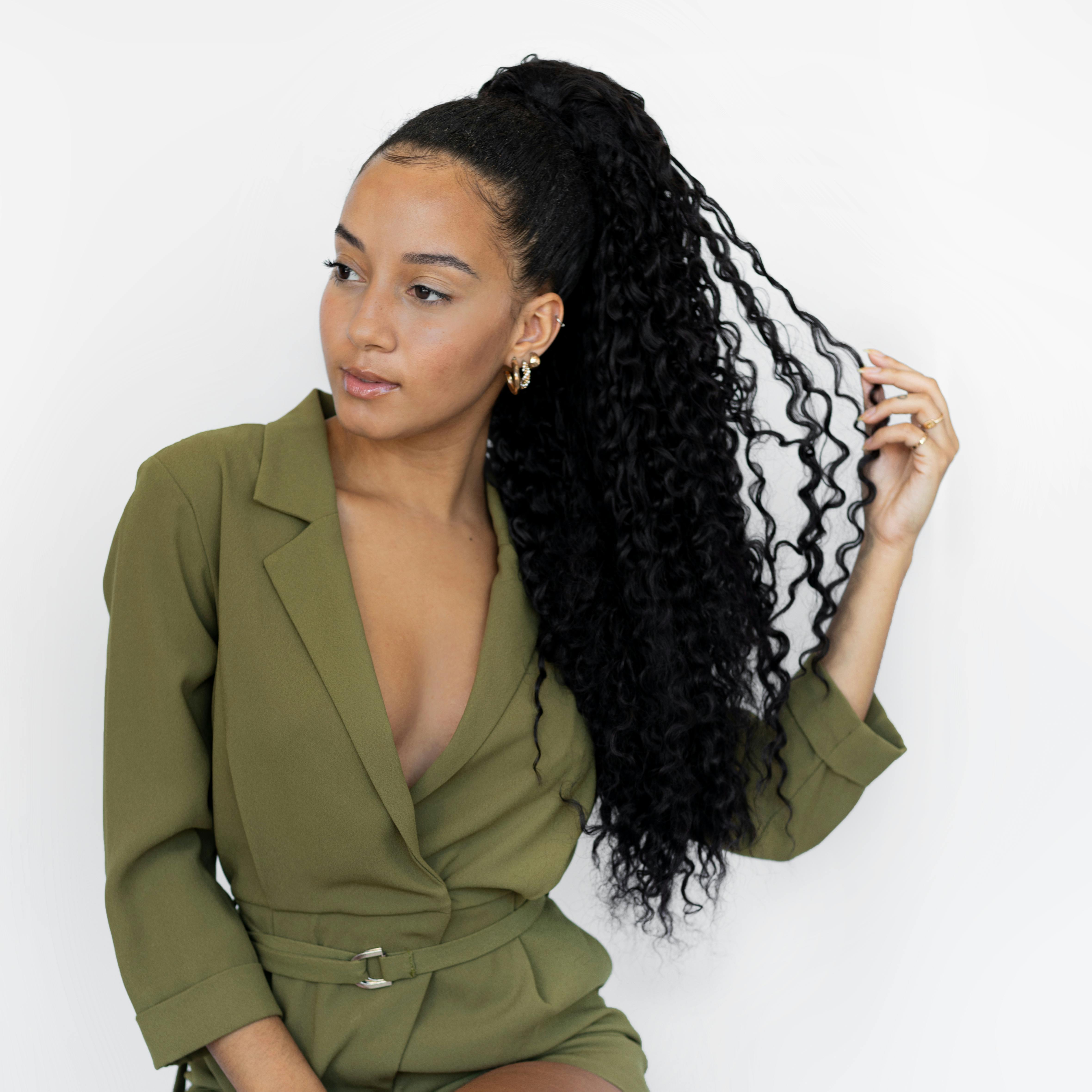 A Curly-Haired Woman in Black Top · Free Stock Photo