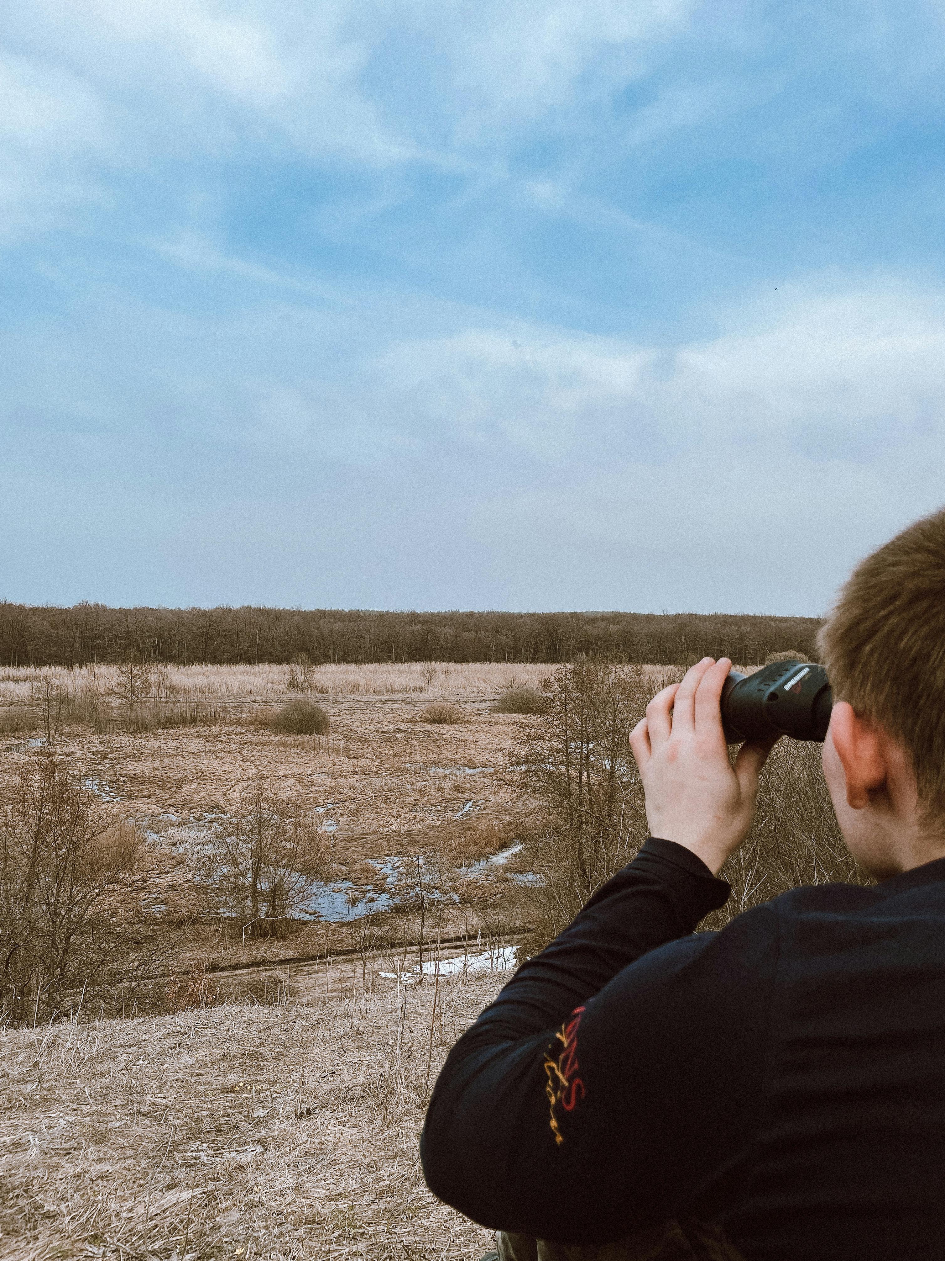 Person Using a Telescope · Free Stock Photo