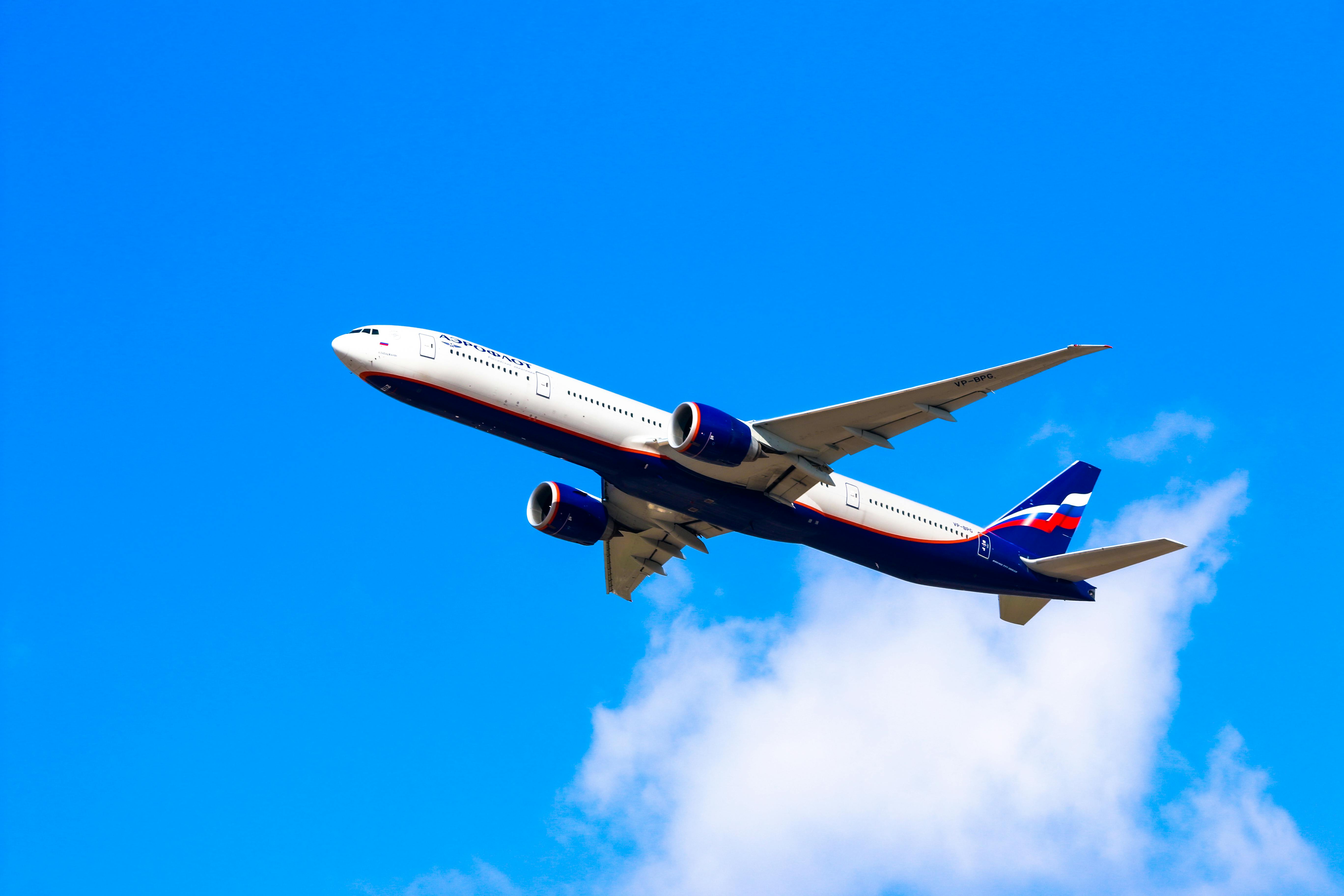 Close-Up Shot of an Airplane Flying · Free Stock Photo