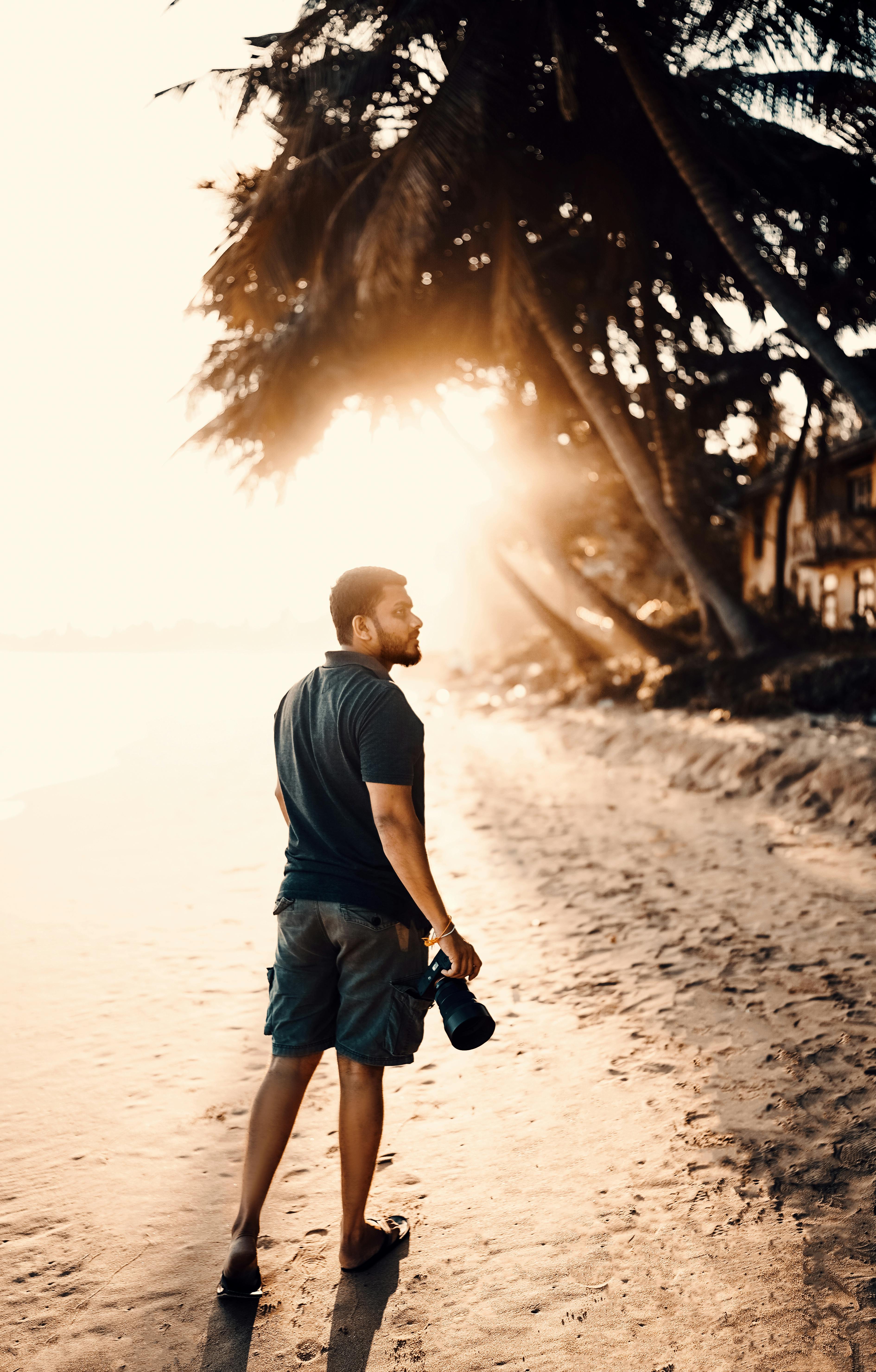 Man with Camera on Beach · Free Stock Photo