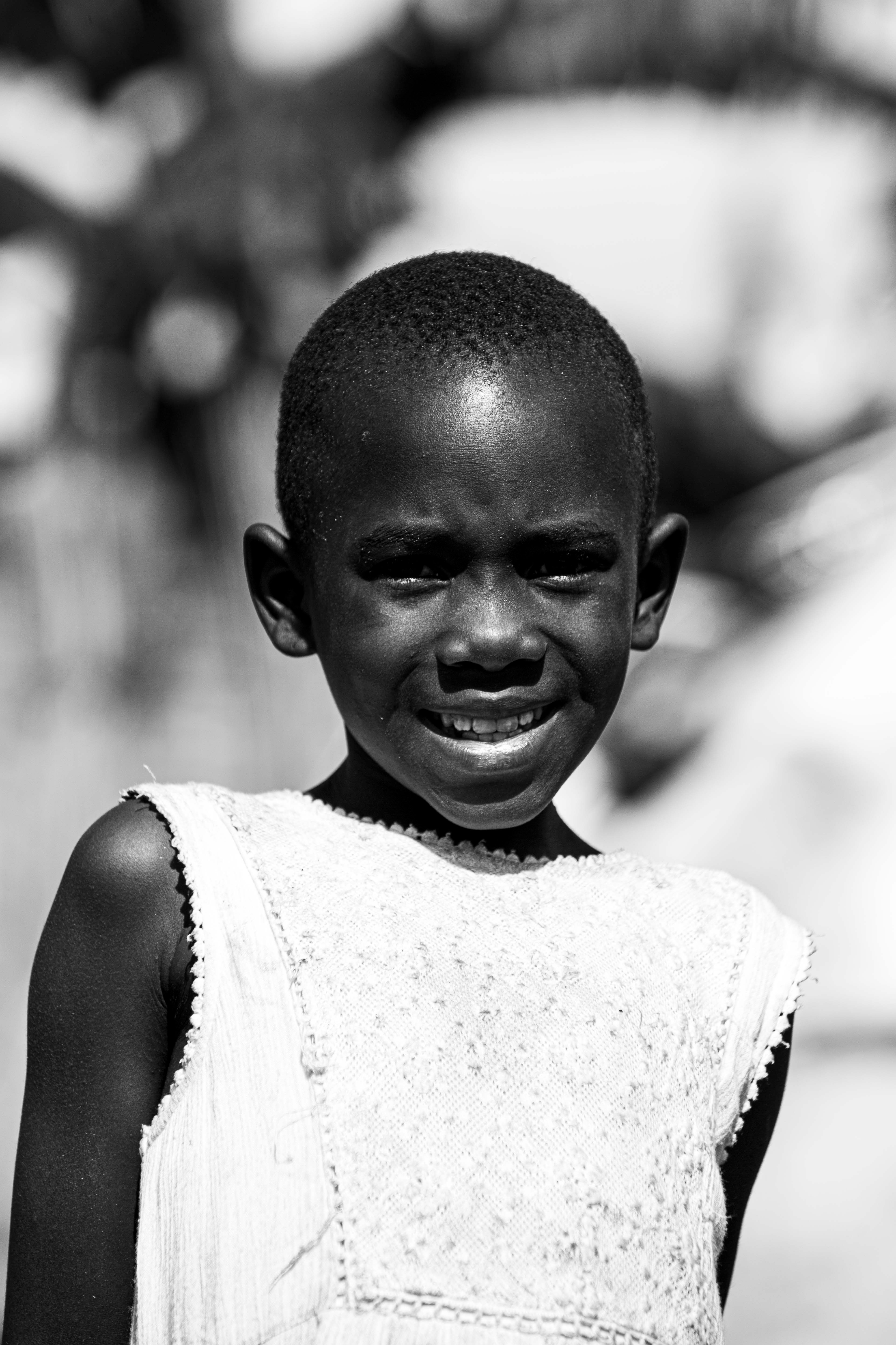 A Grayscale Photo of Young Boys Smiling Together · Free Stock Photo