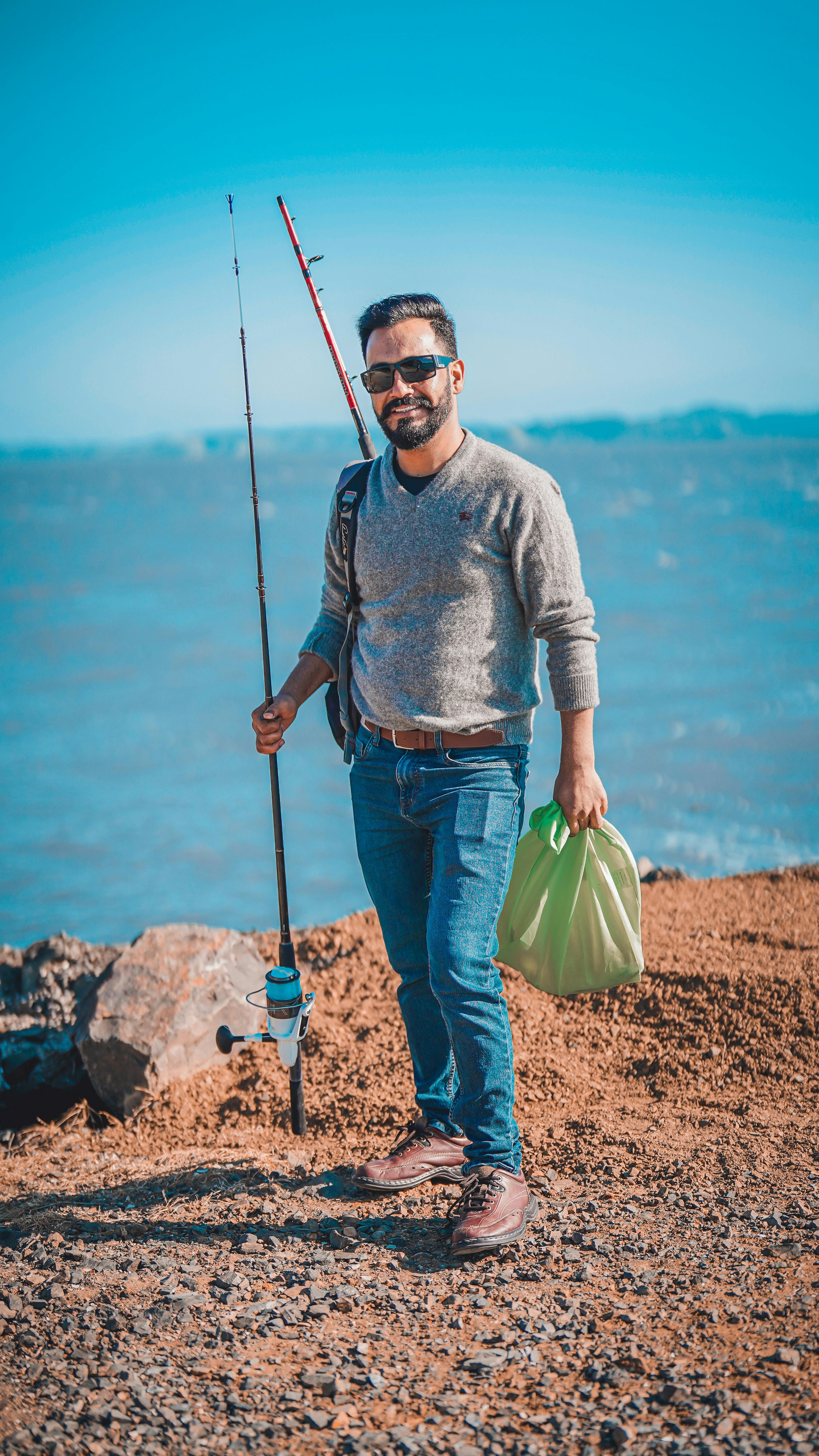 A Man Carrying A Fishing Line Photos, Download The BEST Free A Man ...