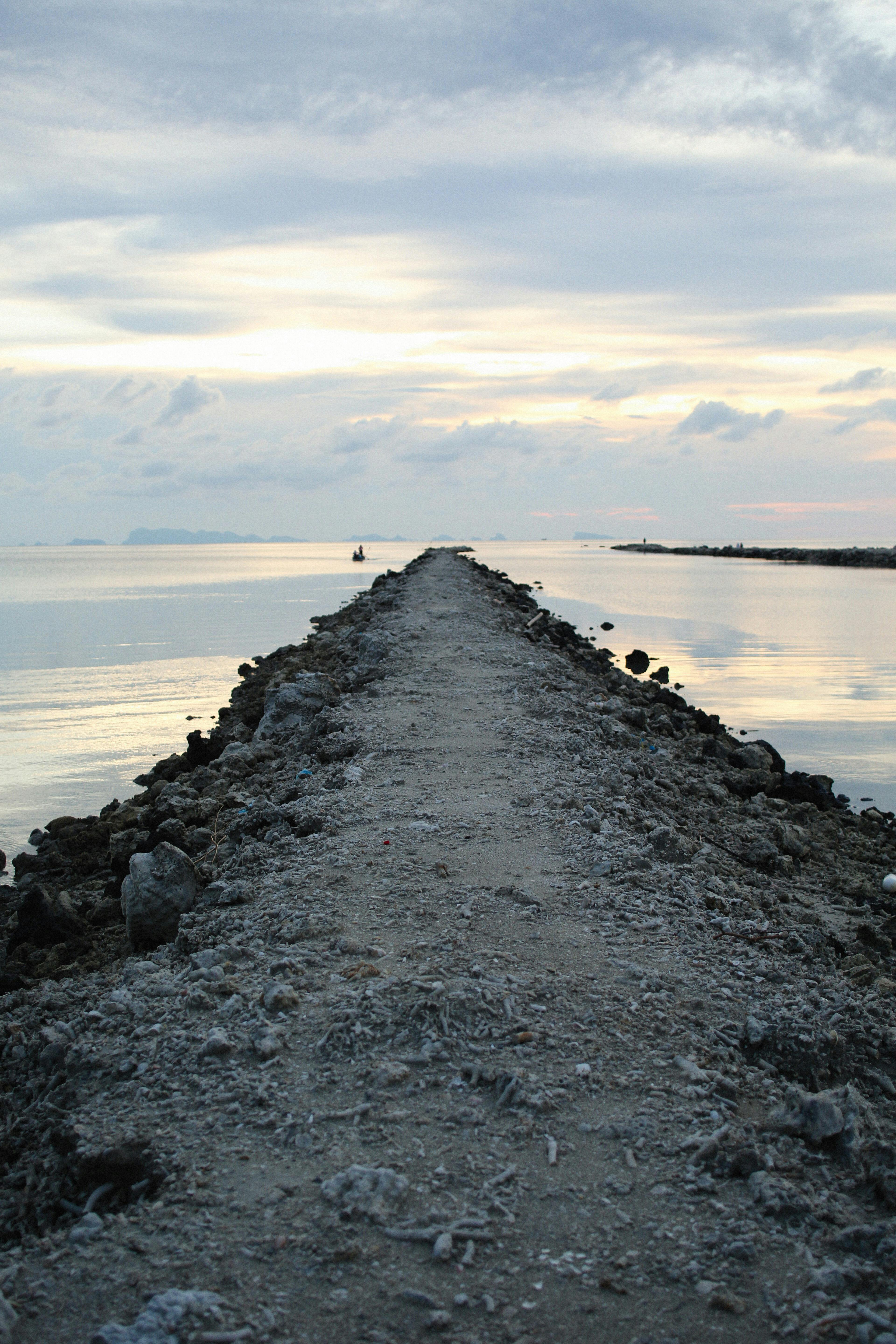 Unpaved Walk Path on Body of Water · Free Stock Photo