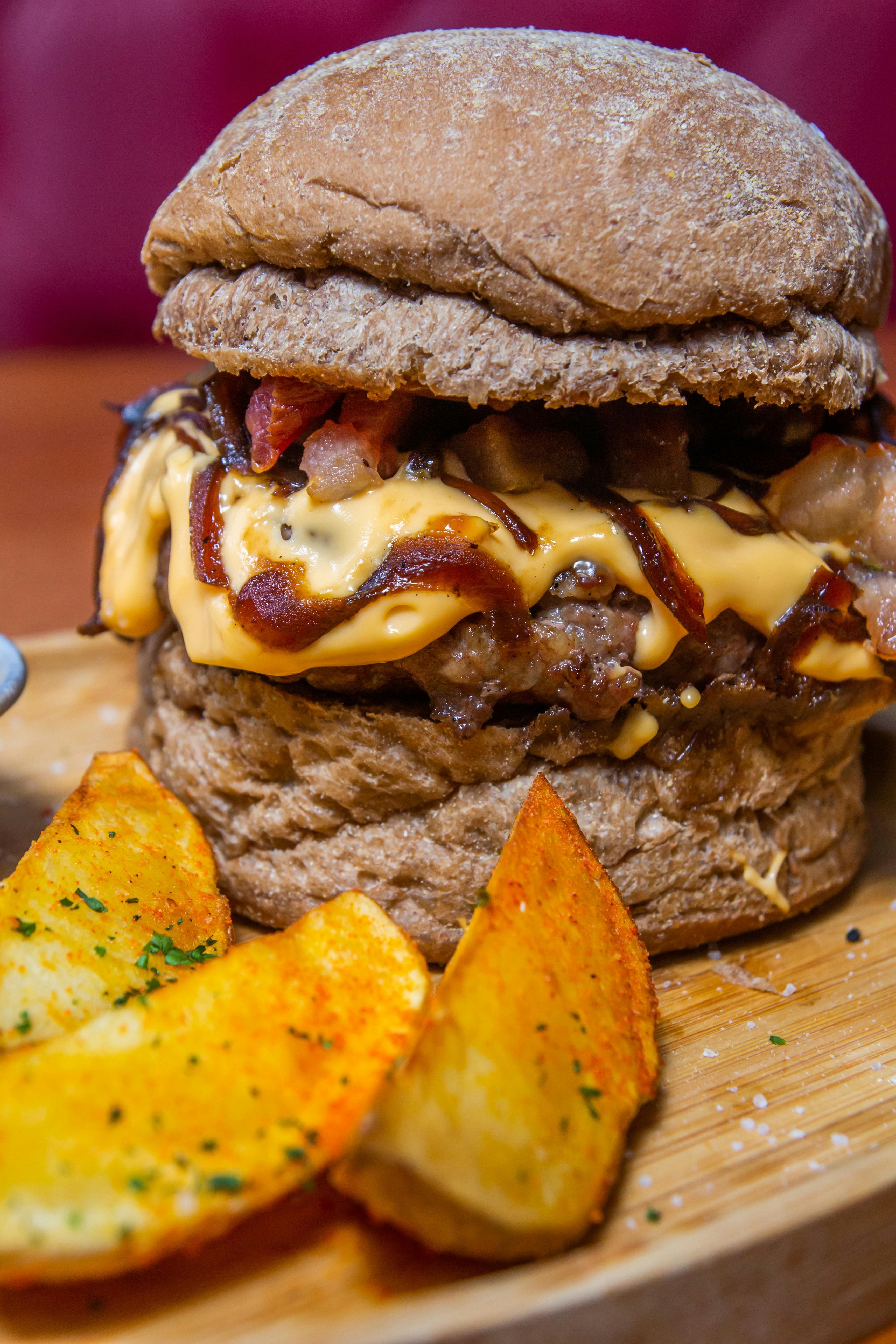 Close-up of a Cheesy Burger · Free Stock Photo