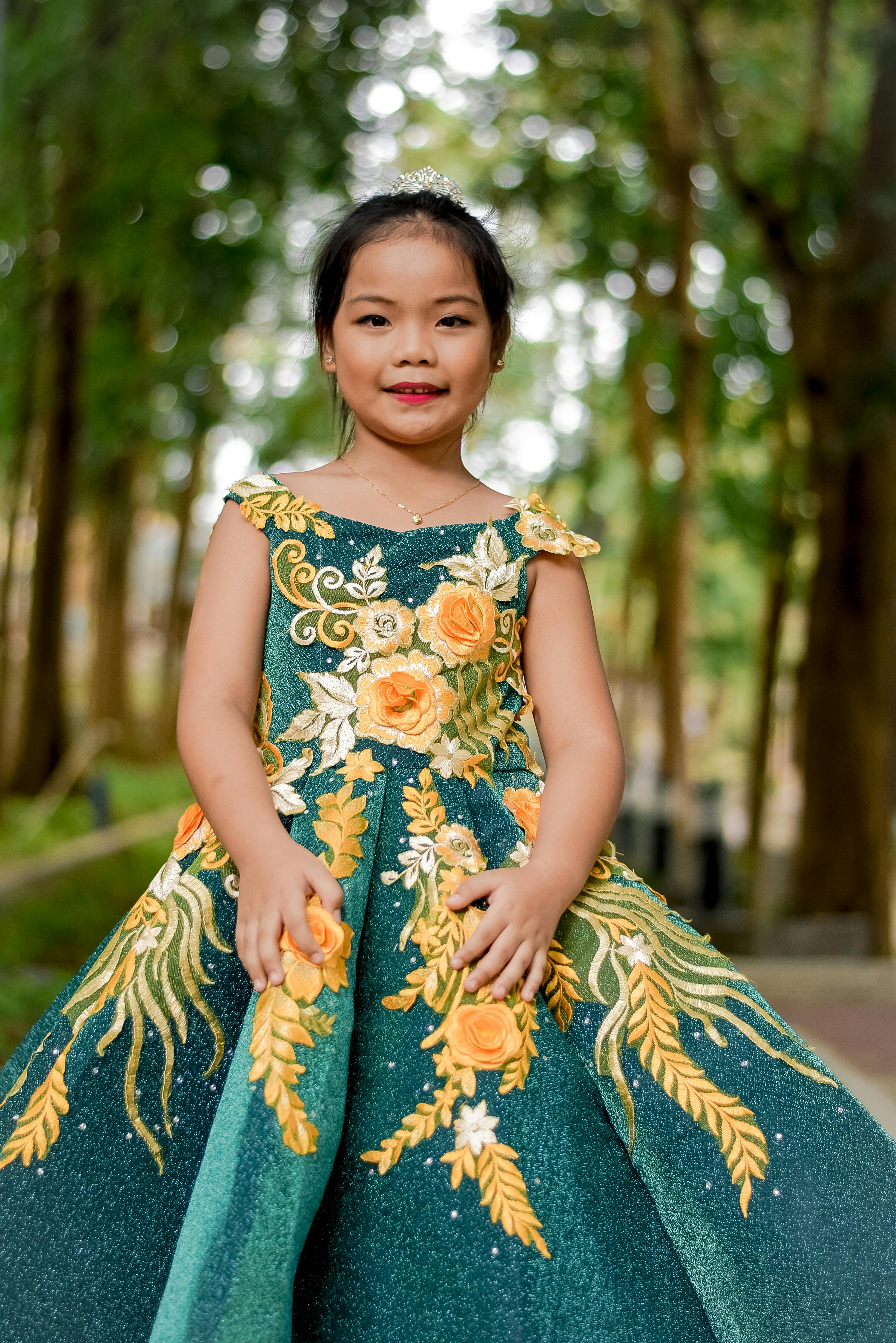 Photo of a Kid Wearing a Gown · Free Stock Photo