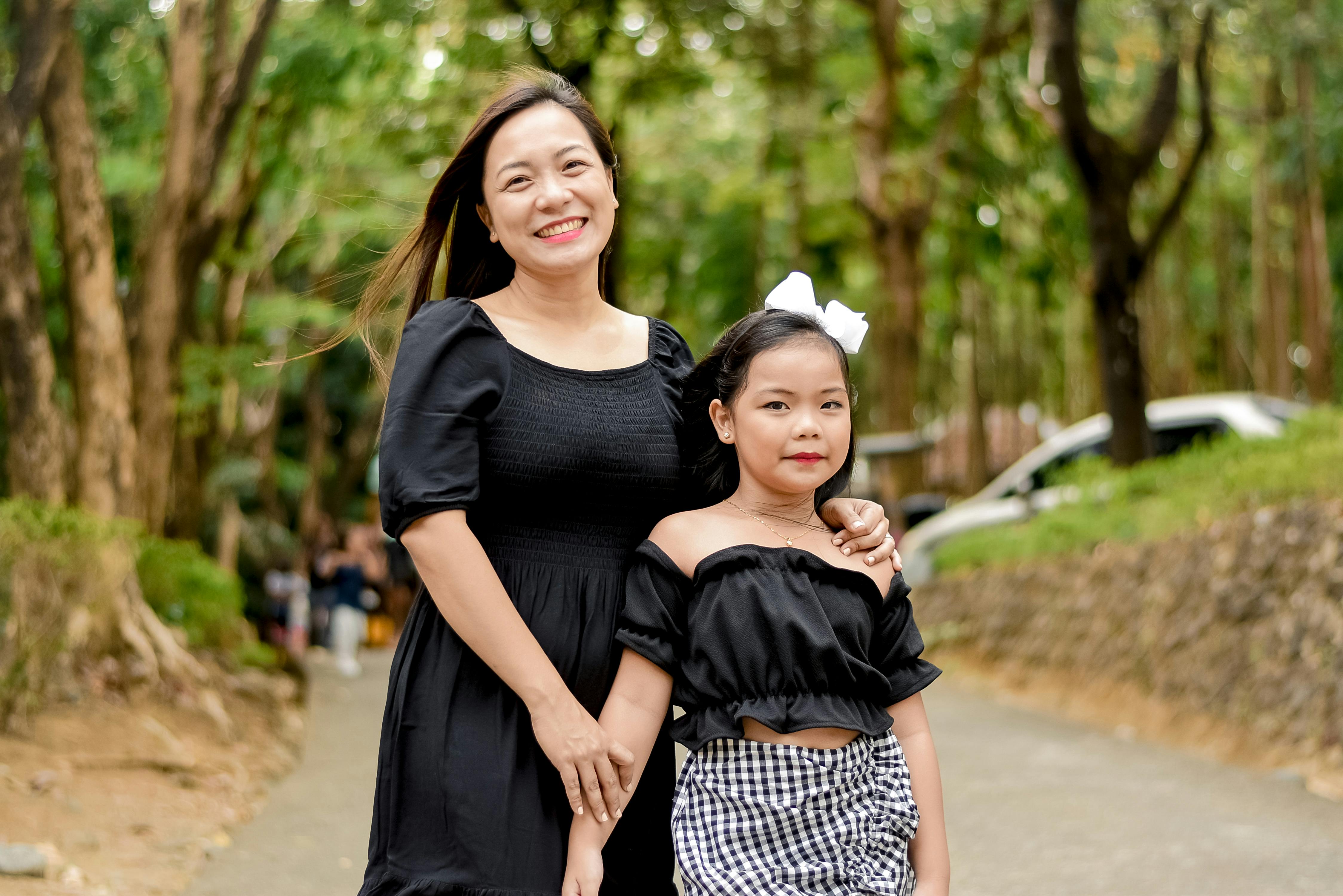 Woman Standing Beside a Girl · Free Stock Photo