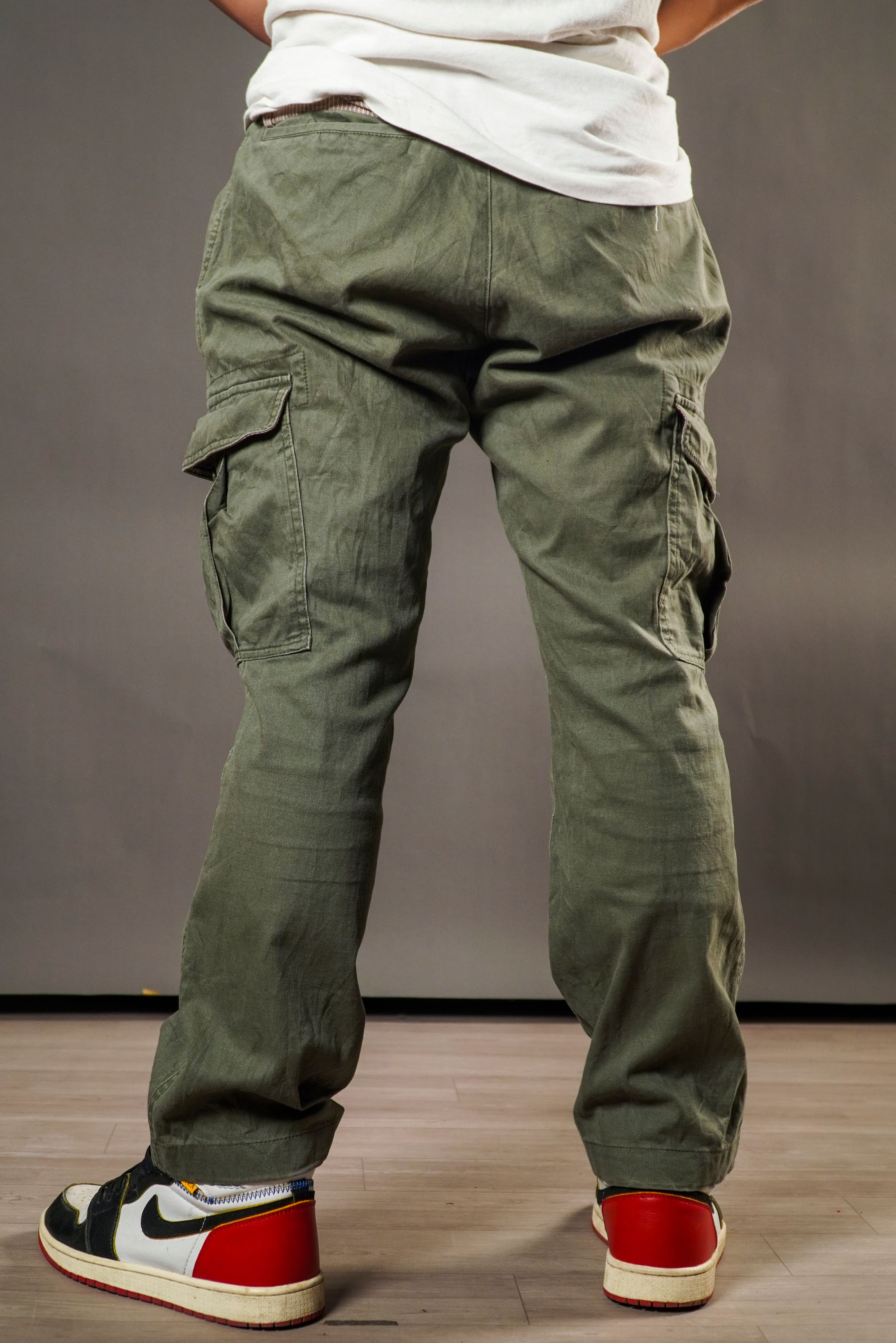 Photo of a Person In Oversize Pants and Trainers · Free Stock Photo
