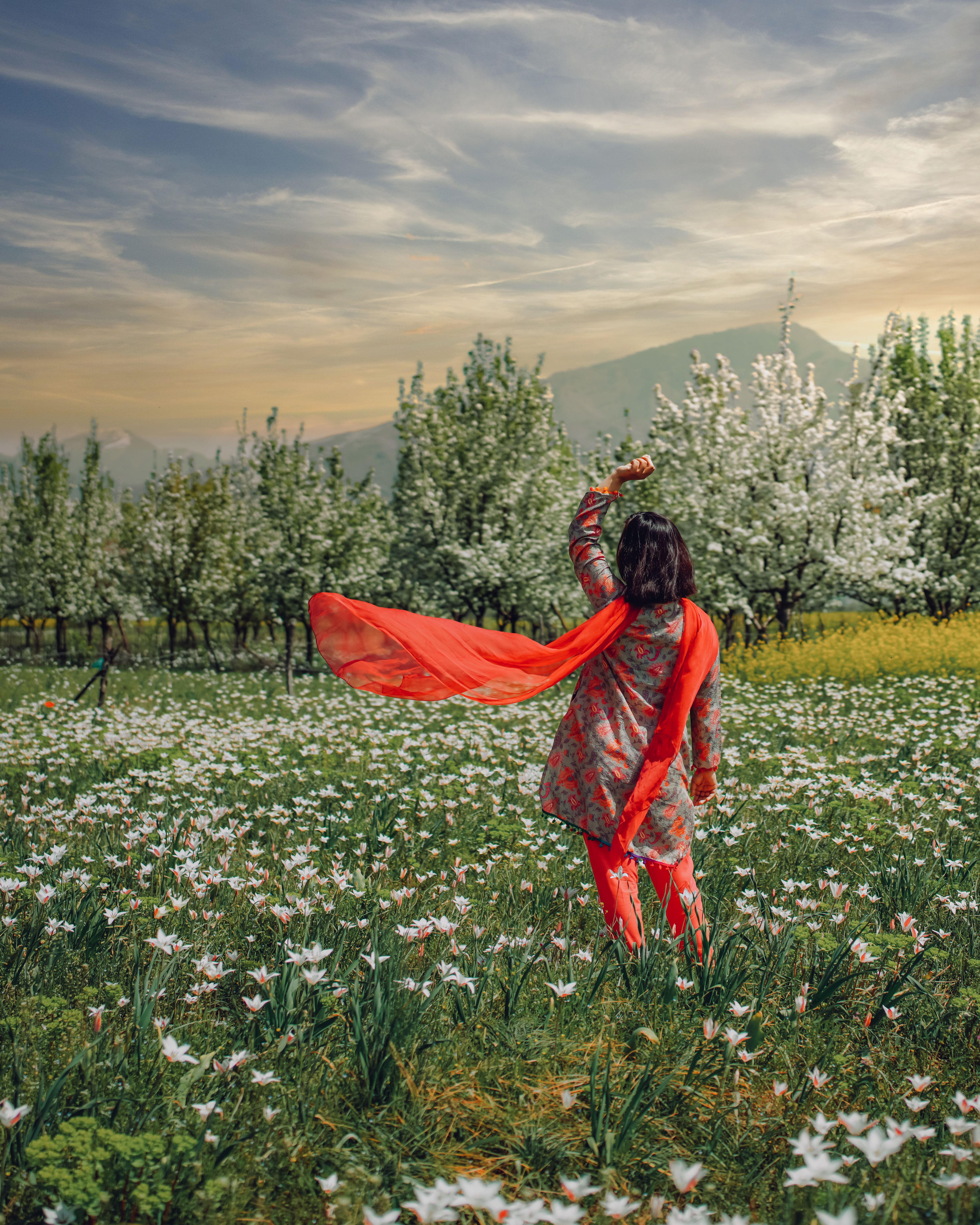 Girl Dancing In Field Of Flowers