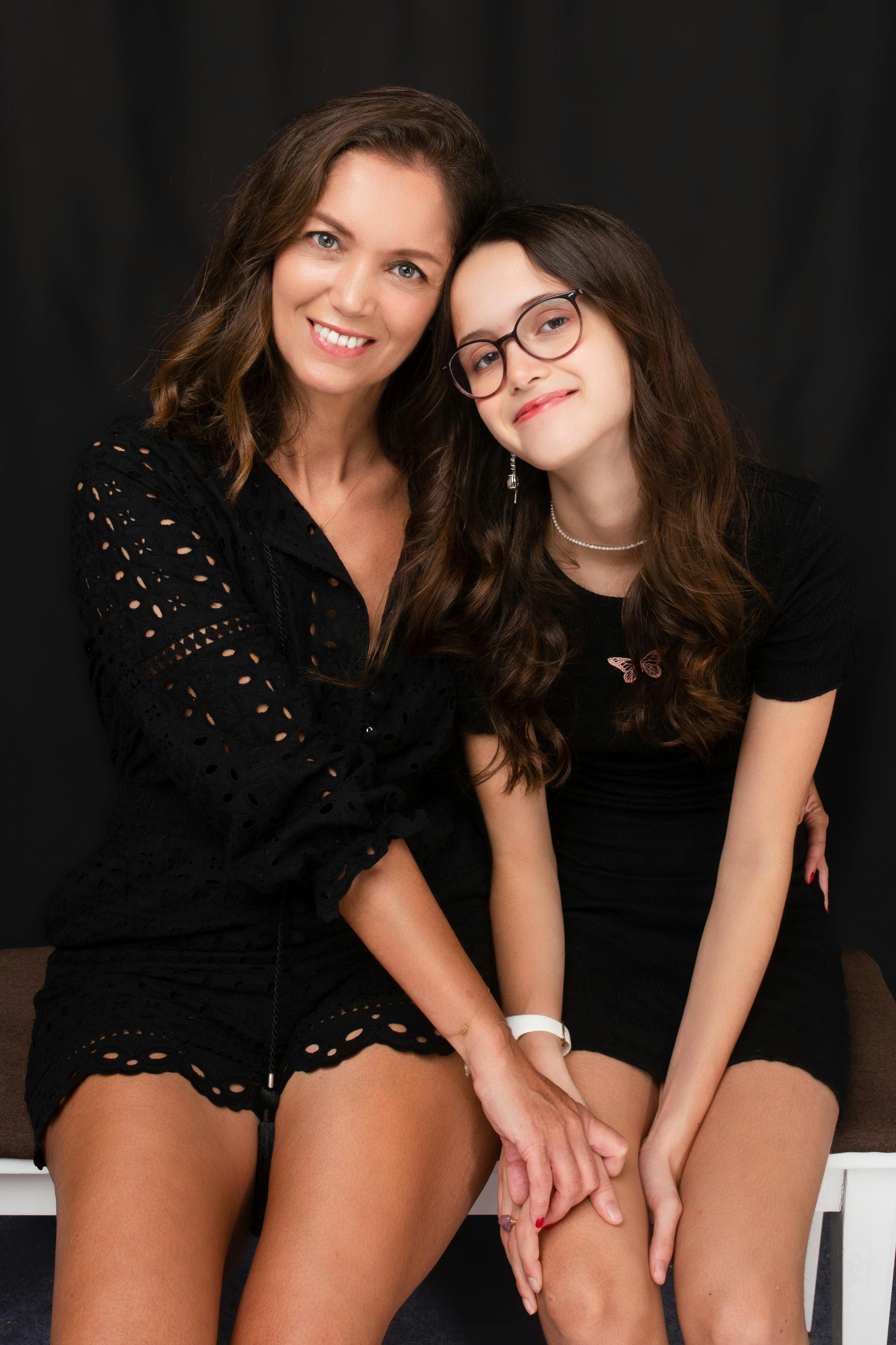 Mother and Daughter Posing Together · Free Stock Photo
