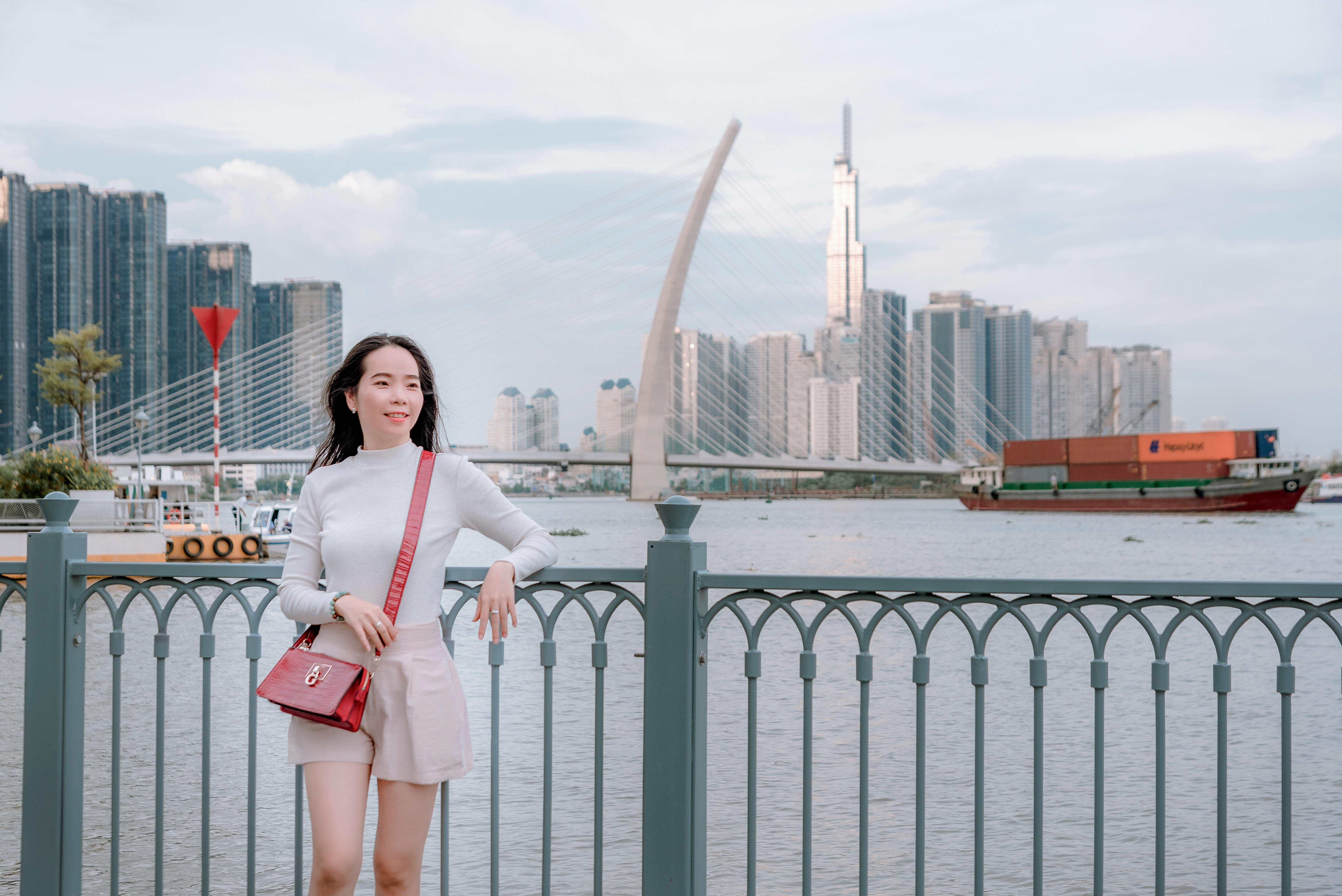 A Woman Leaning on a Railing · Free Stock Photo