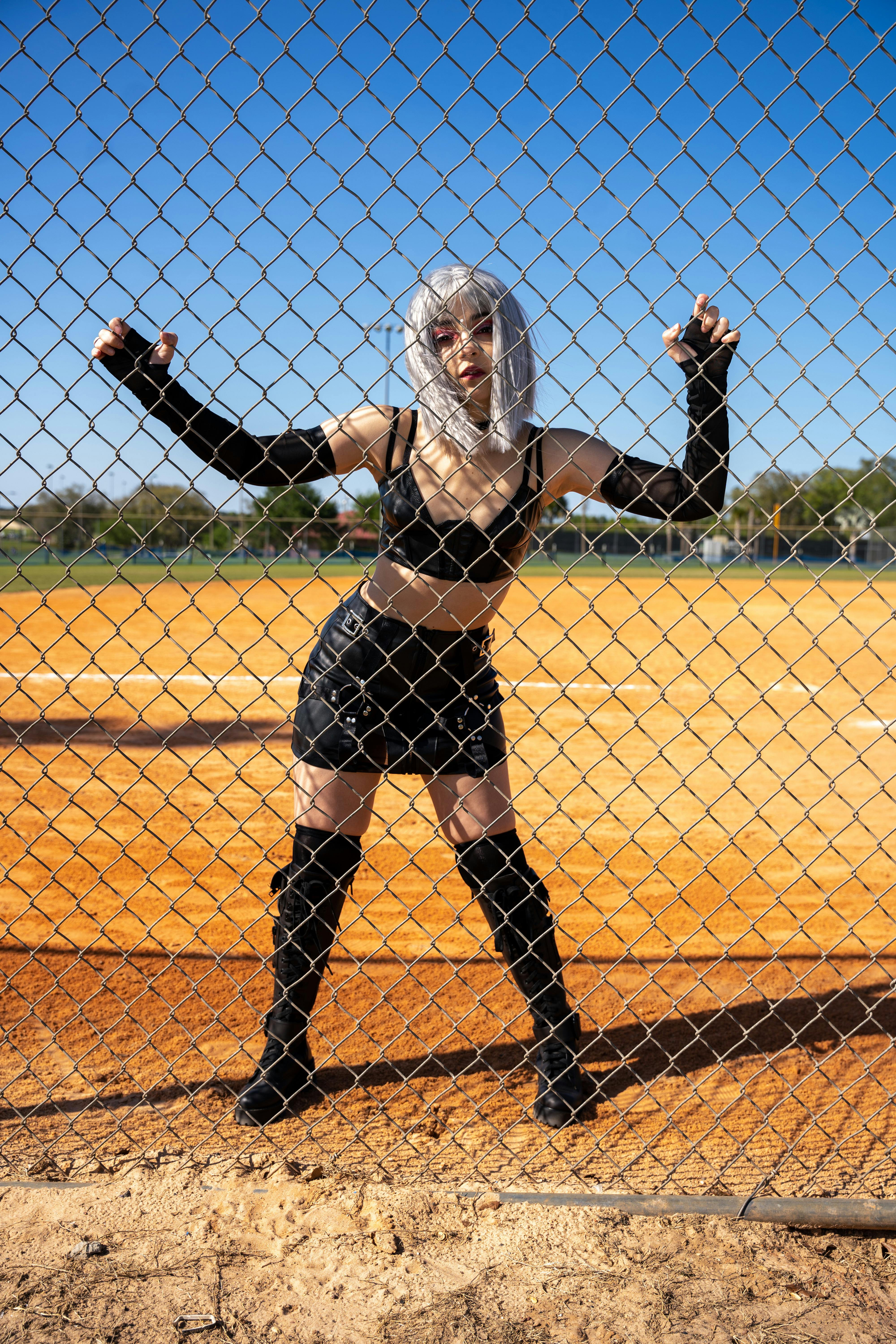 Woman Behind Chain Link Fence · Free Stock Photo