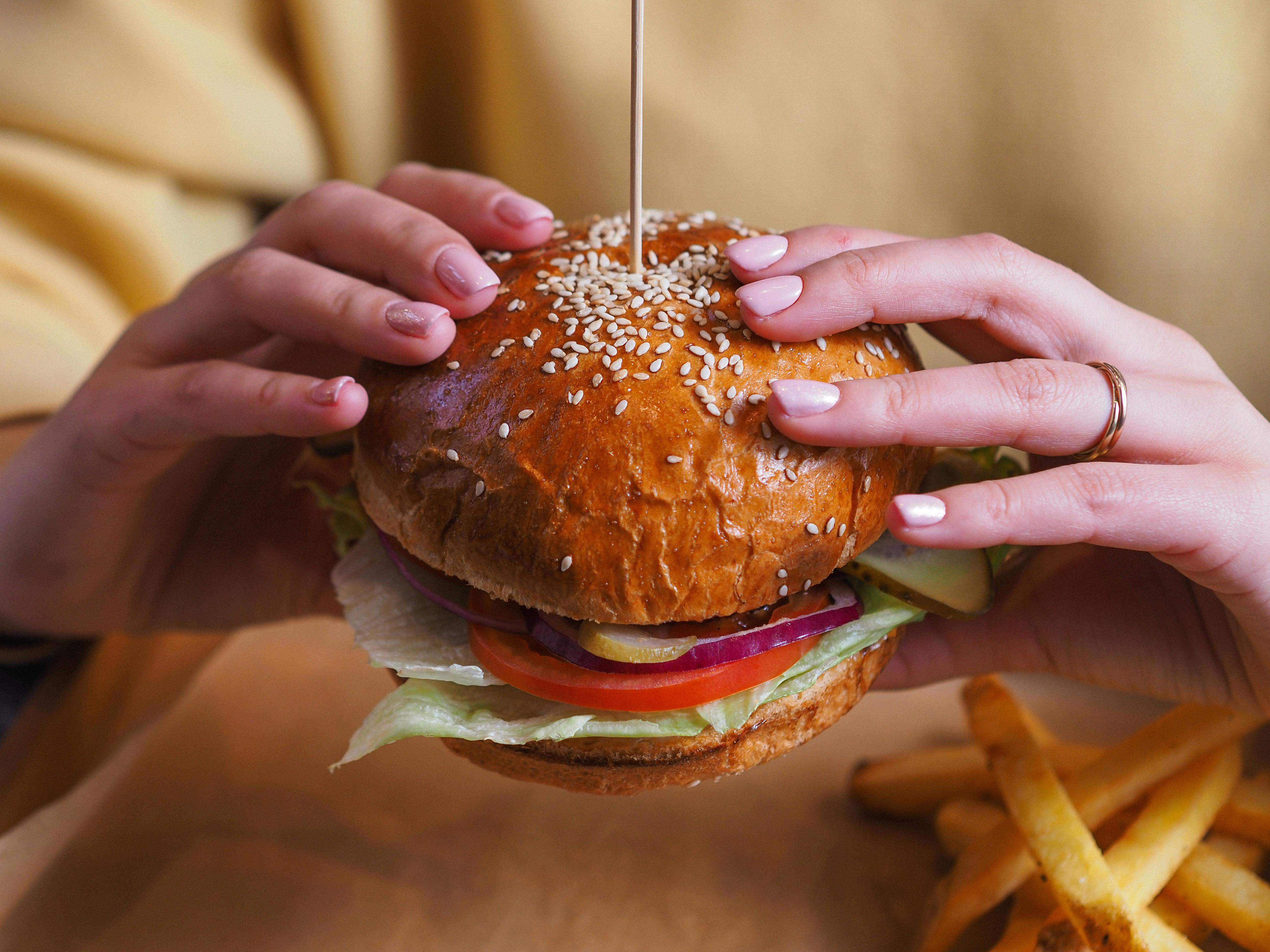 Person Holding Burger · Free Stock Photo