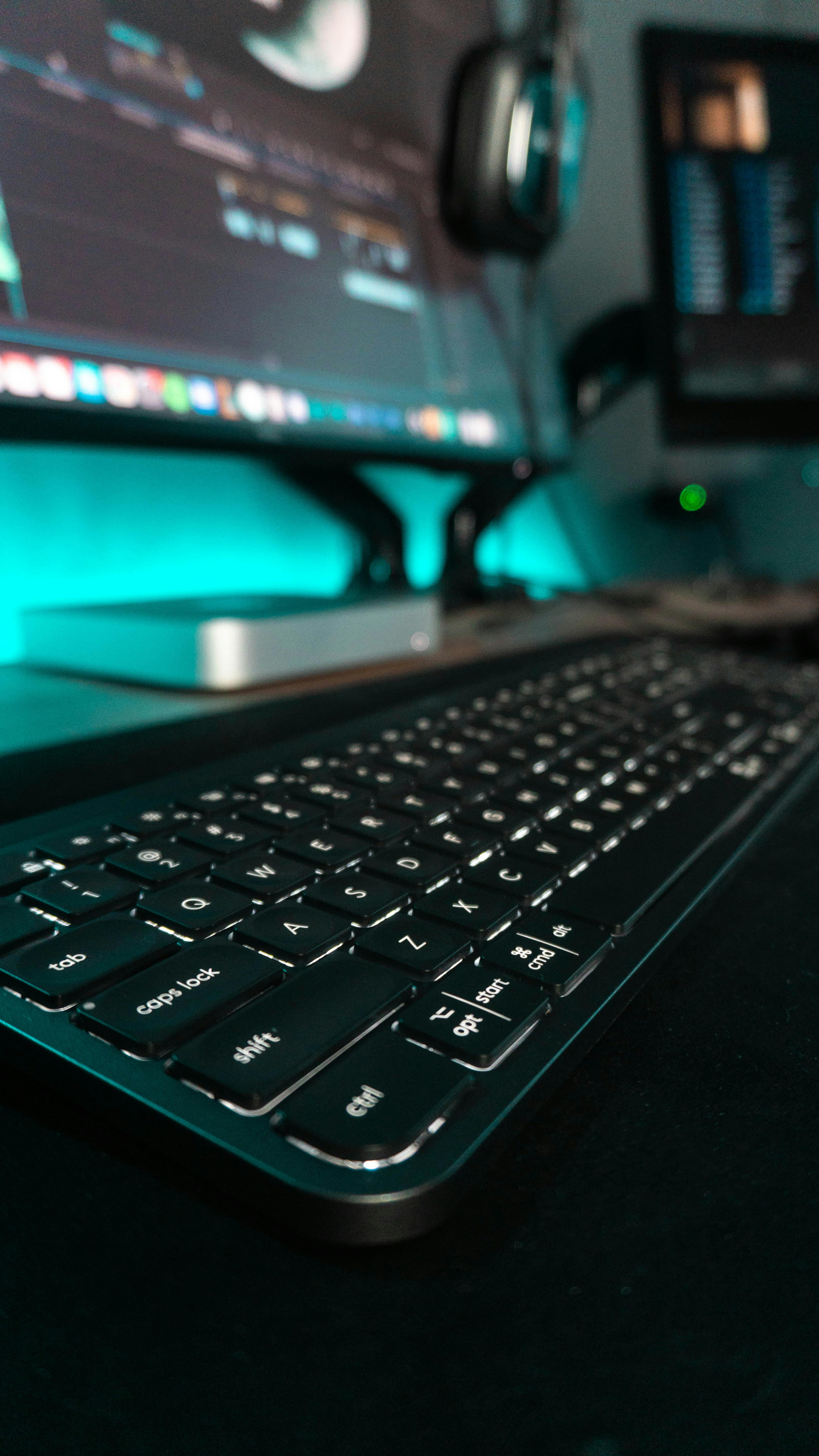 Canon Camera Lens Covers Beside Screwdriver and Computer Keyboard ...