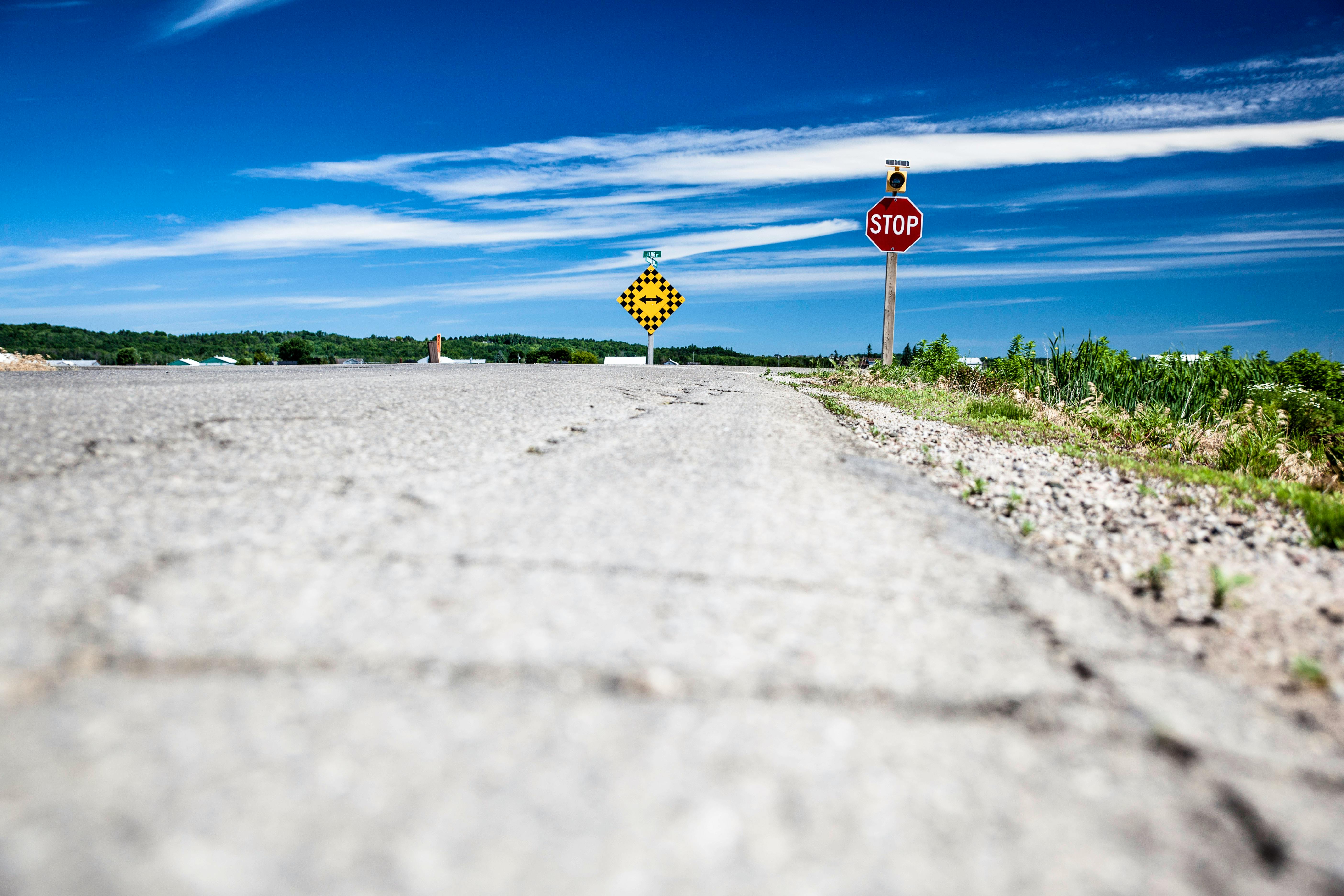 Stop Street Sign on Side of Road · Free Stock Photo
