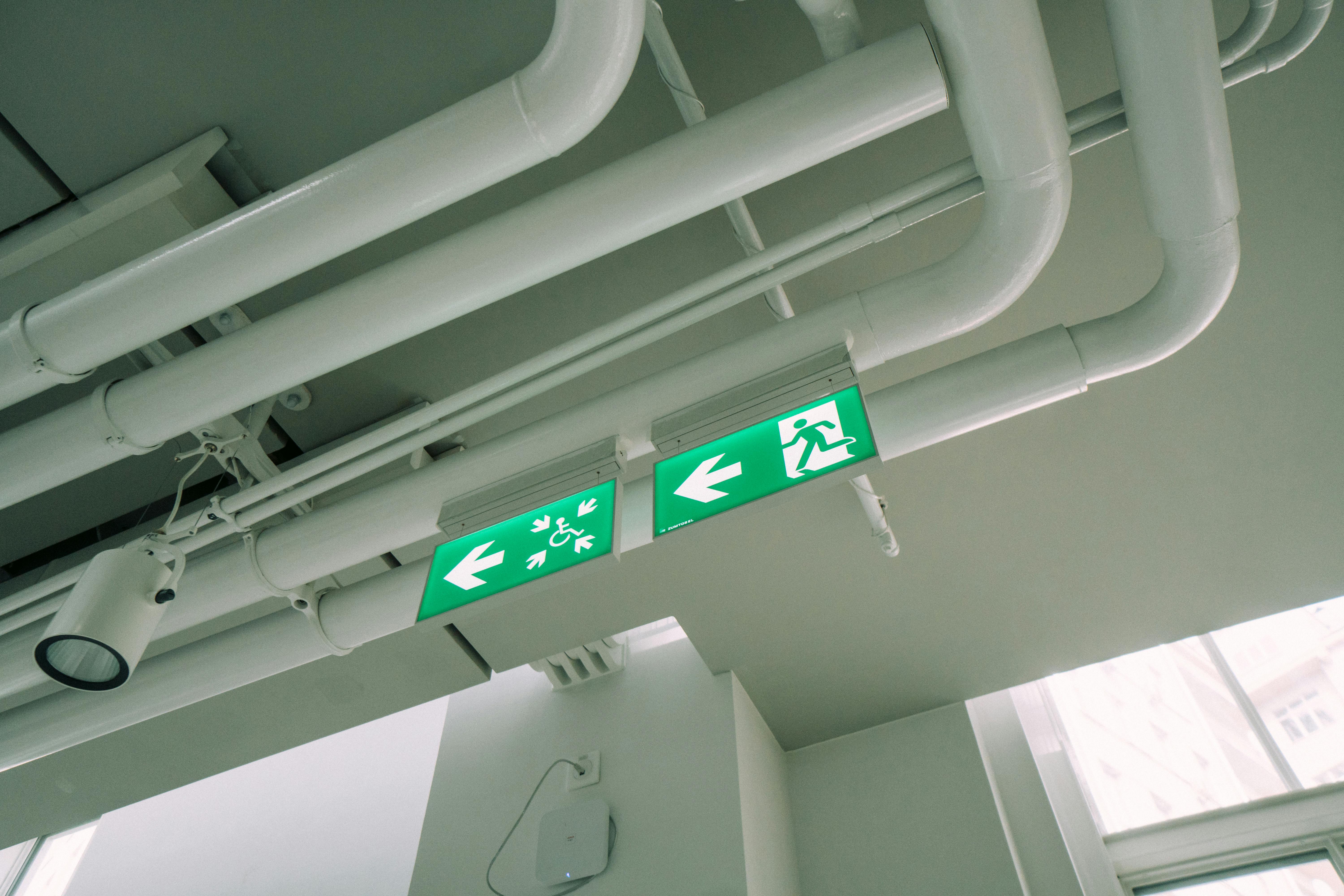 Exit Sign on Pipes · Free Stock Photo