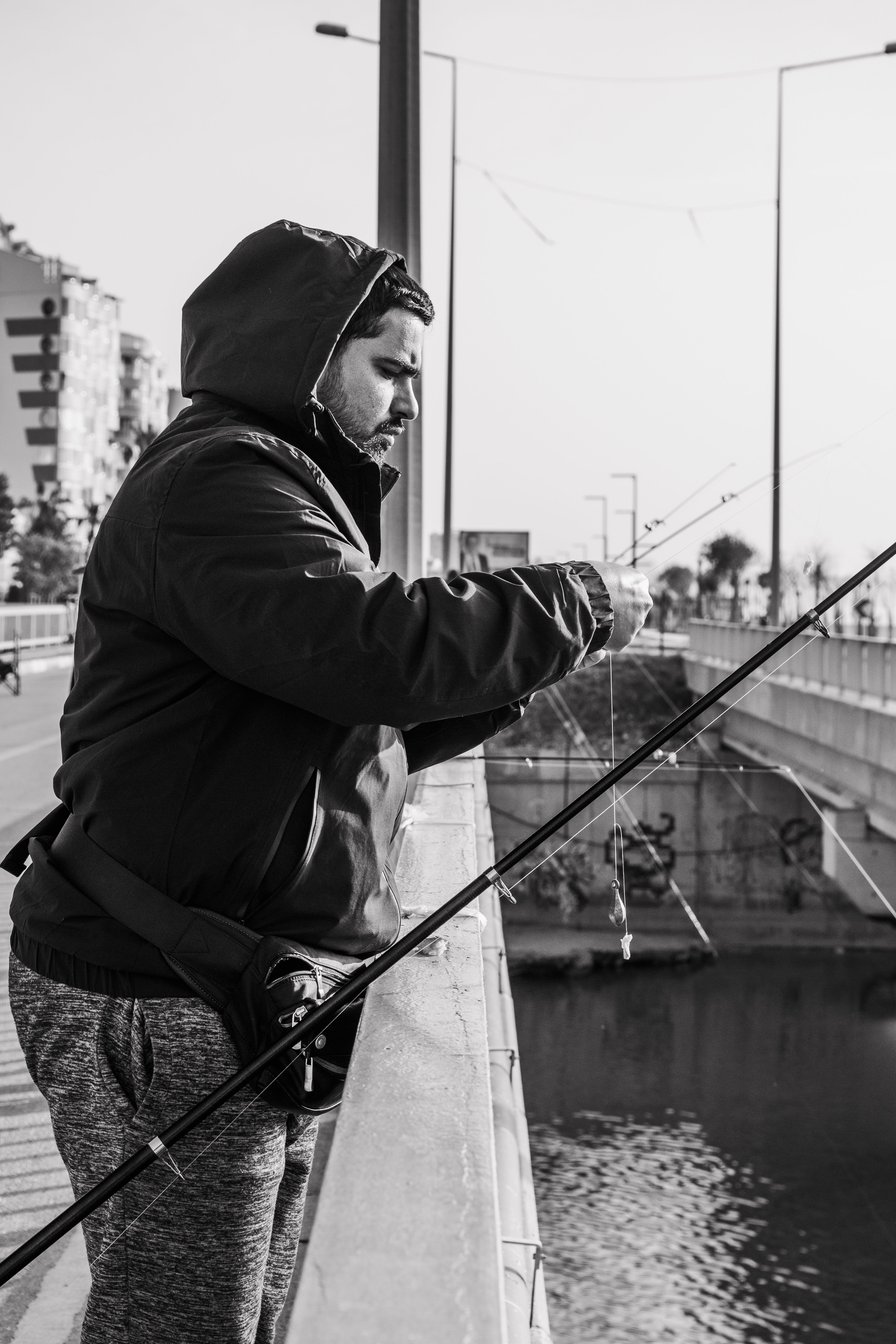 A Man Walking Near the Ocean while Carrying a Big Fish · Free Stock Photo