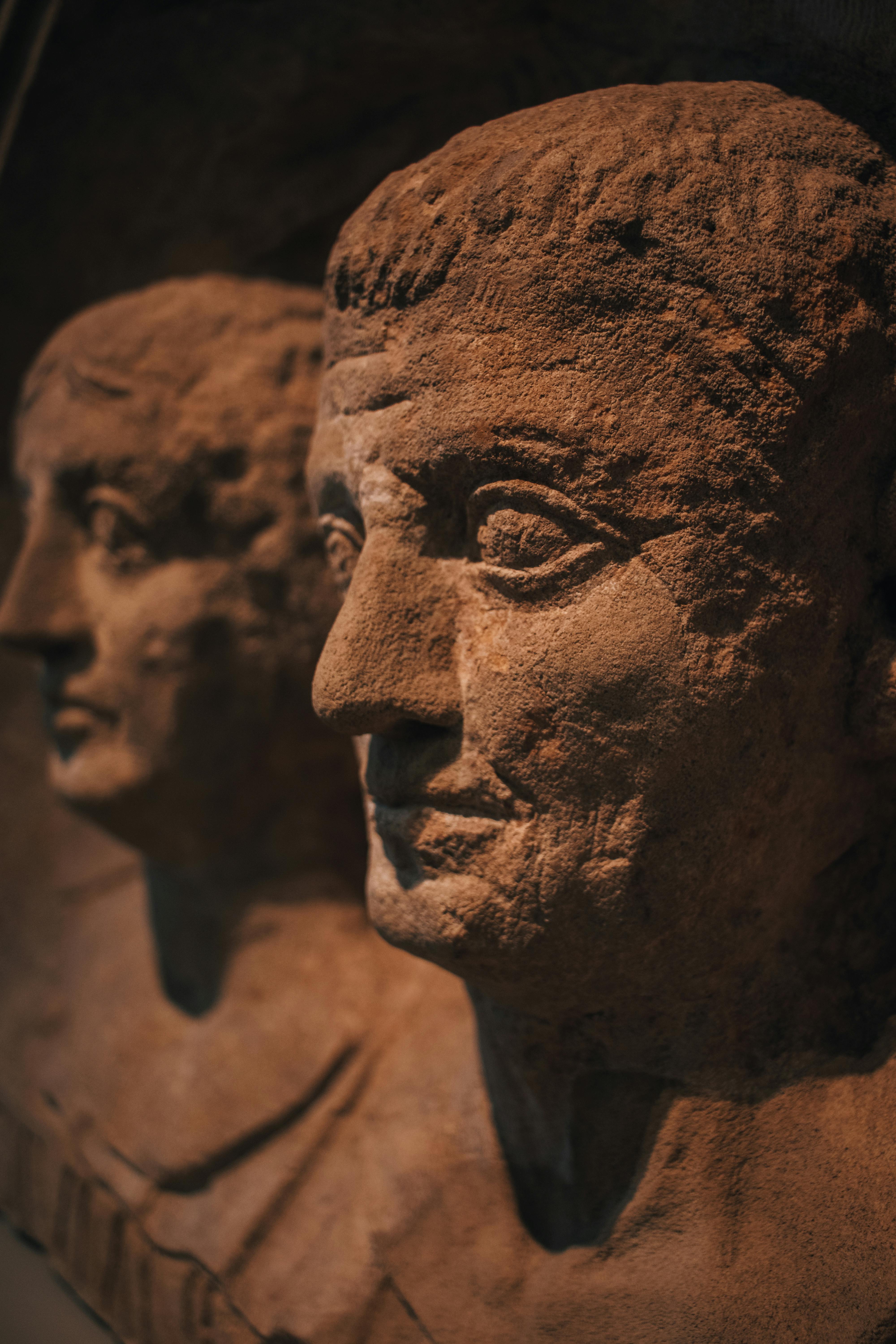 Close-up of Ancient Stone Heads in Museum · Free Stock Photo