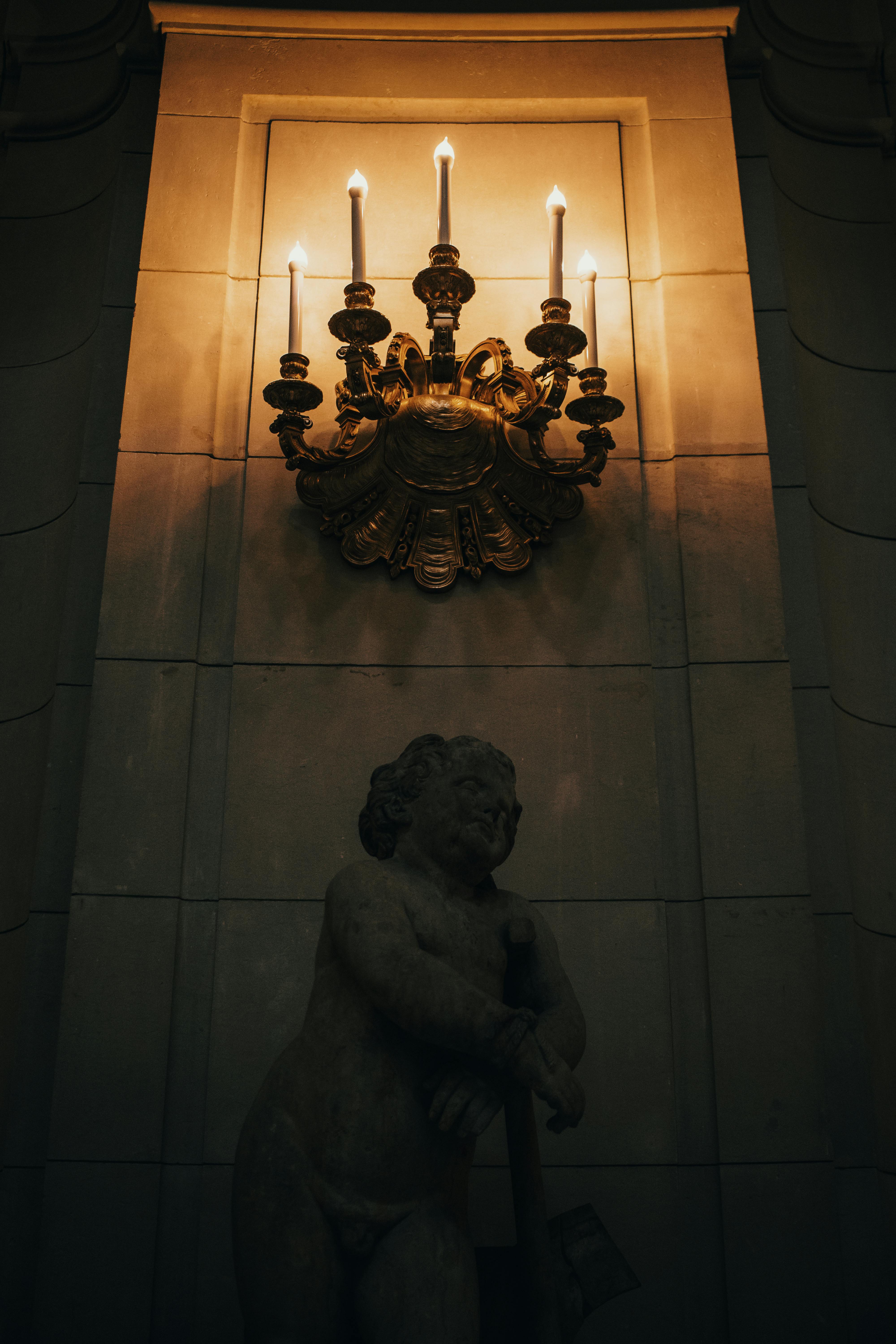 Ancient Sculpture Art with Wall Light · Free Stock Photo