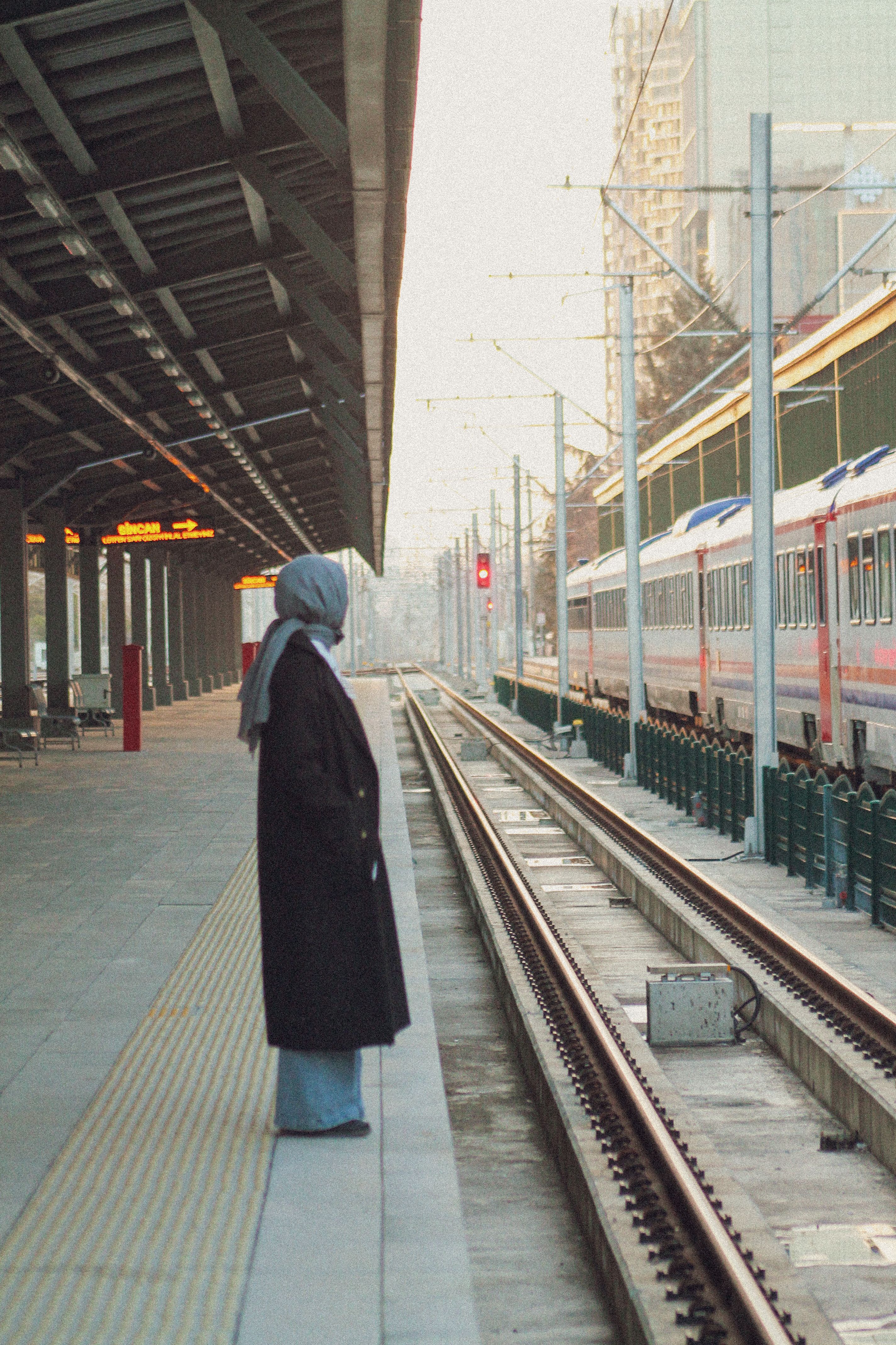 Woman Standing on Platform at the Train Station · Free Stock Photo