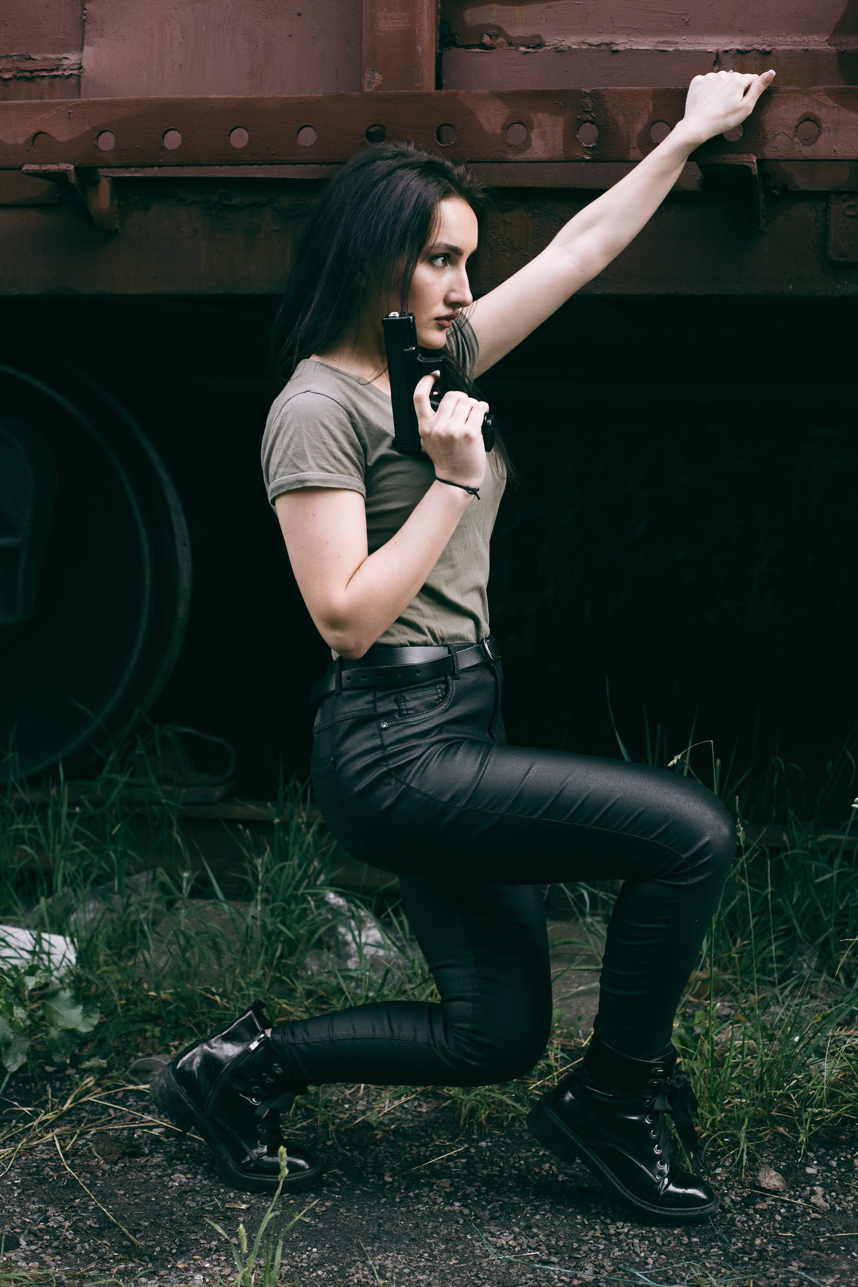 Woman Holding a Bullet · Free Stock Photo