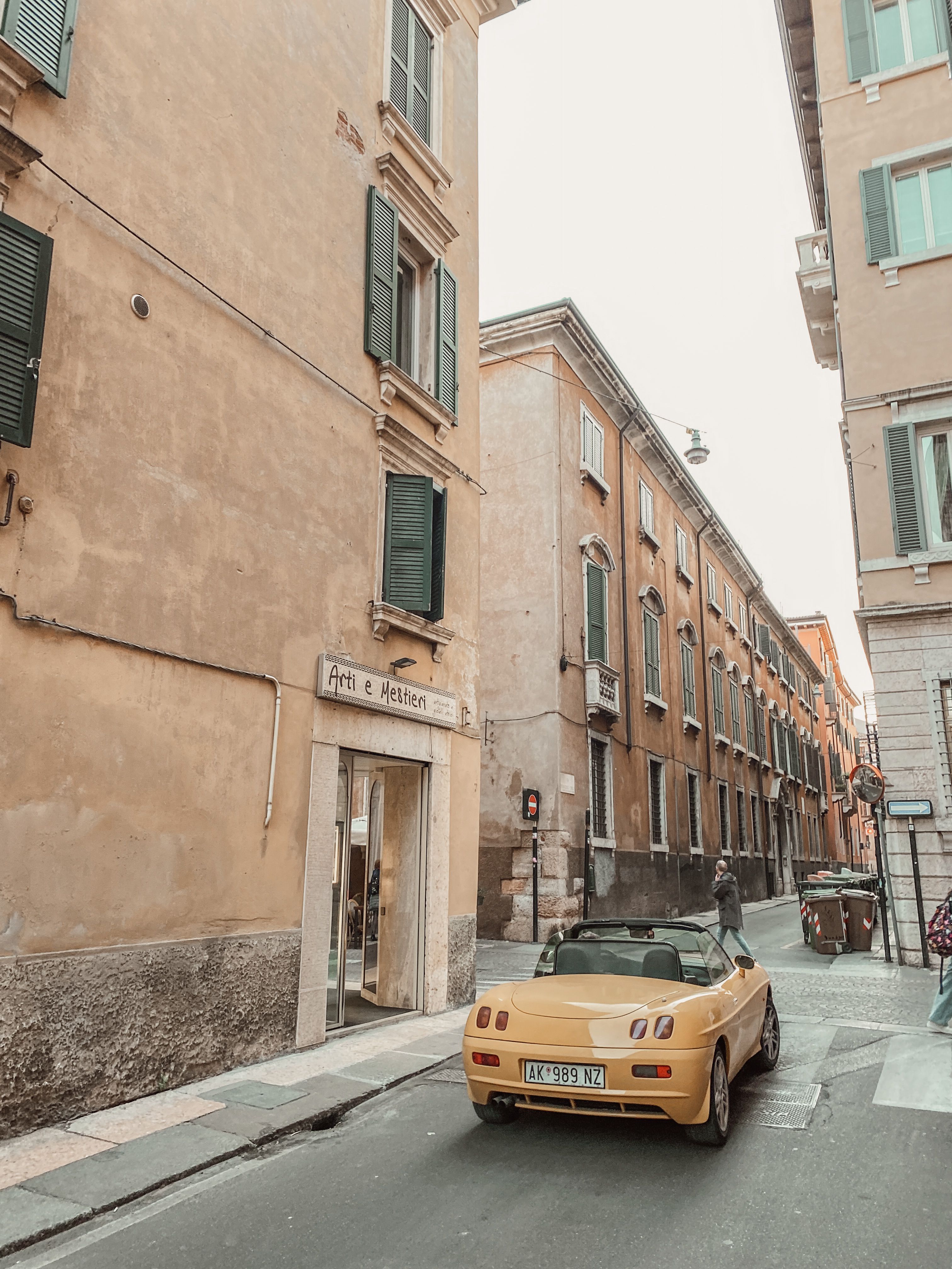 A Car Parked Between Buildings · Free Stock Photo