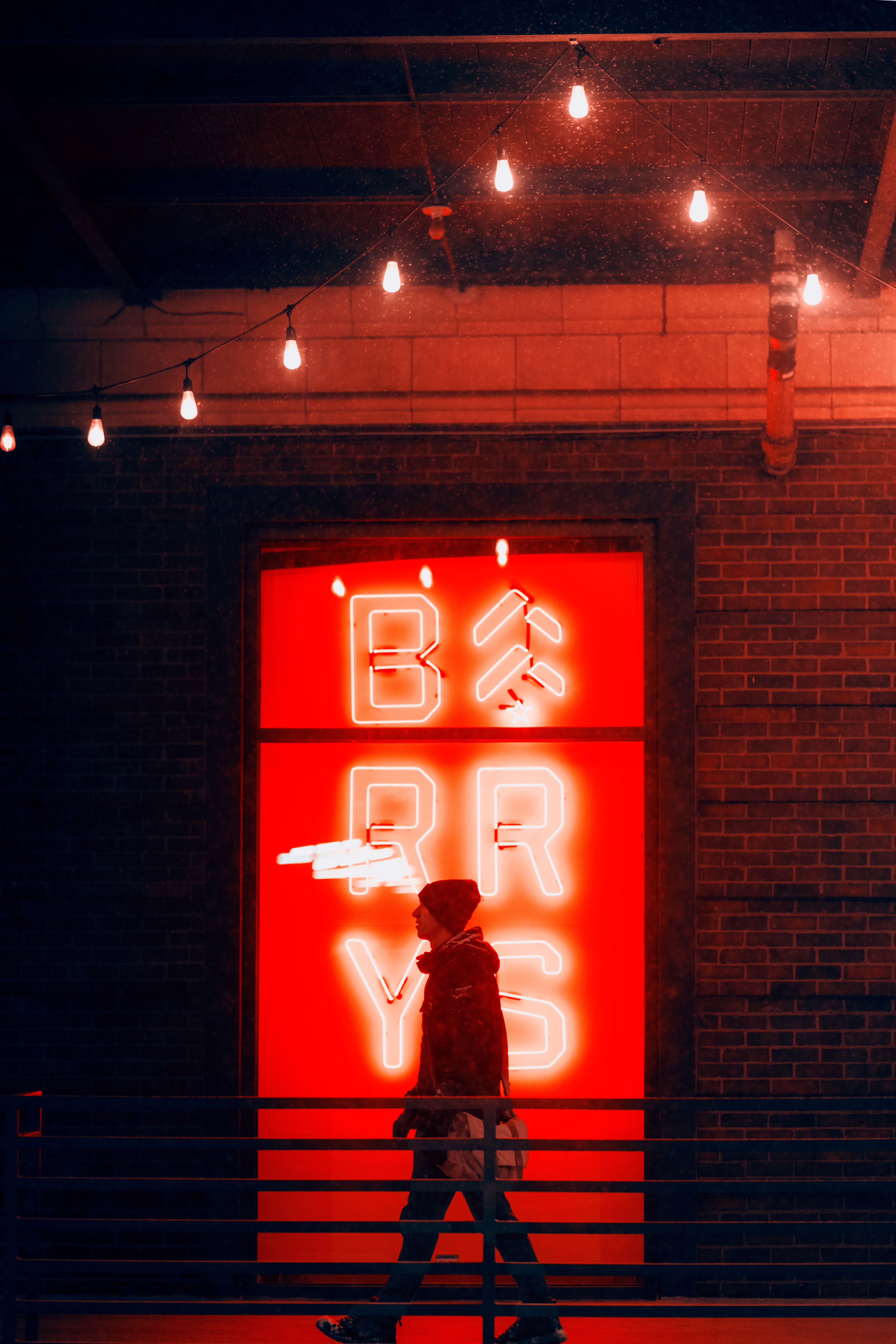 Man Walking outside a Building · Free Stock Photo