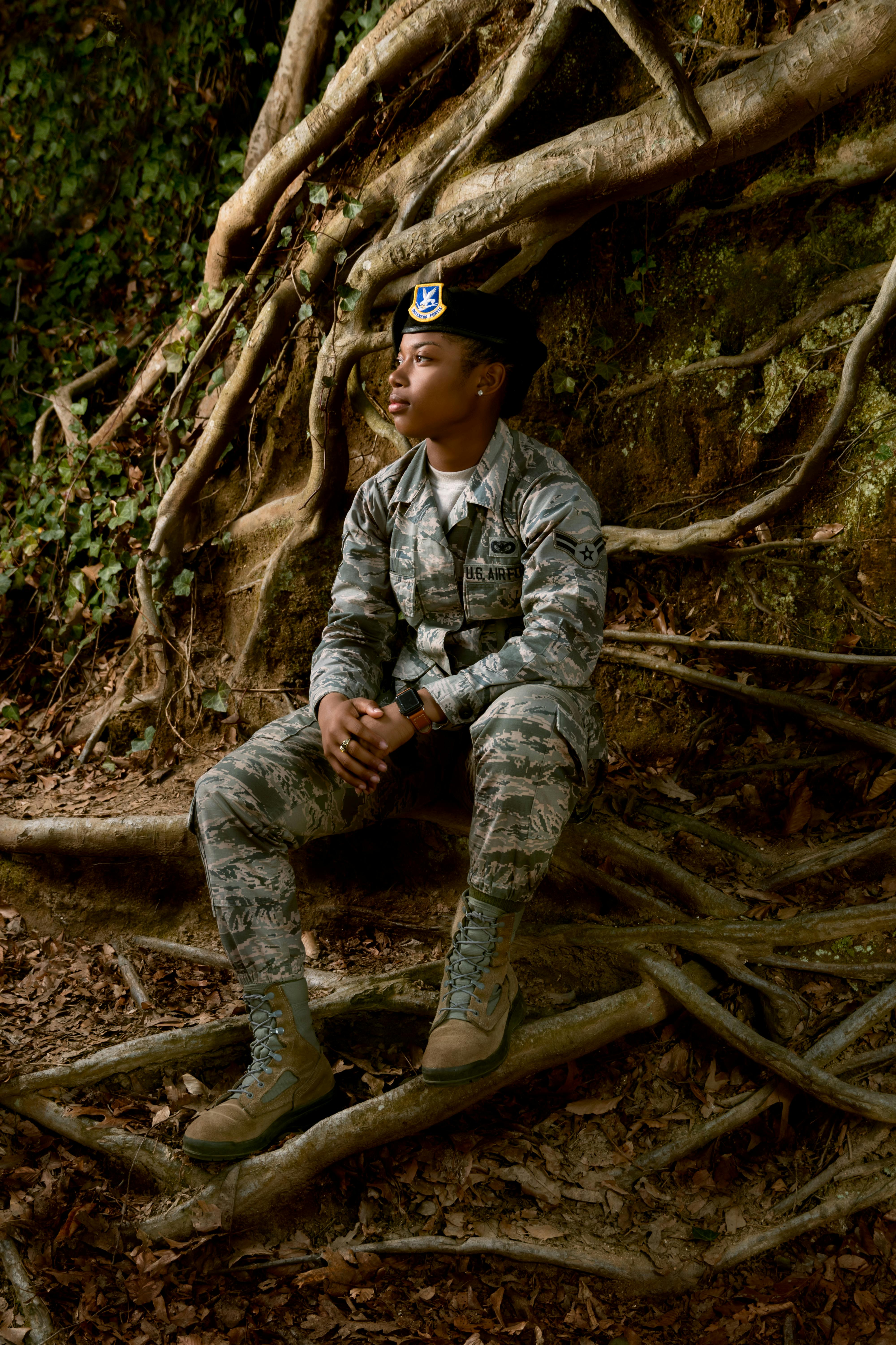 A Soldier Sitting on the Roots of a Tree · Free Stock Photo