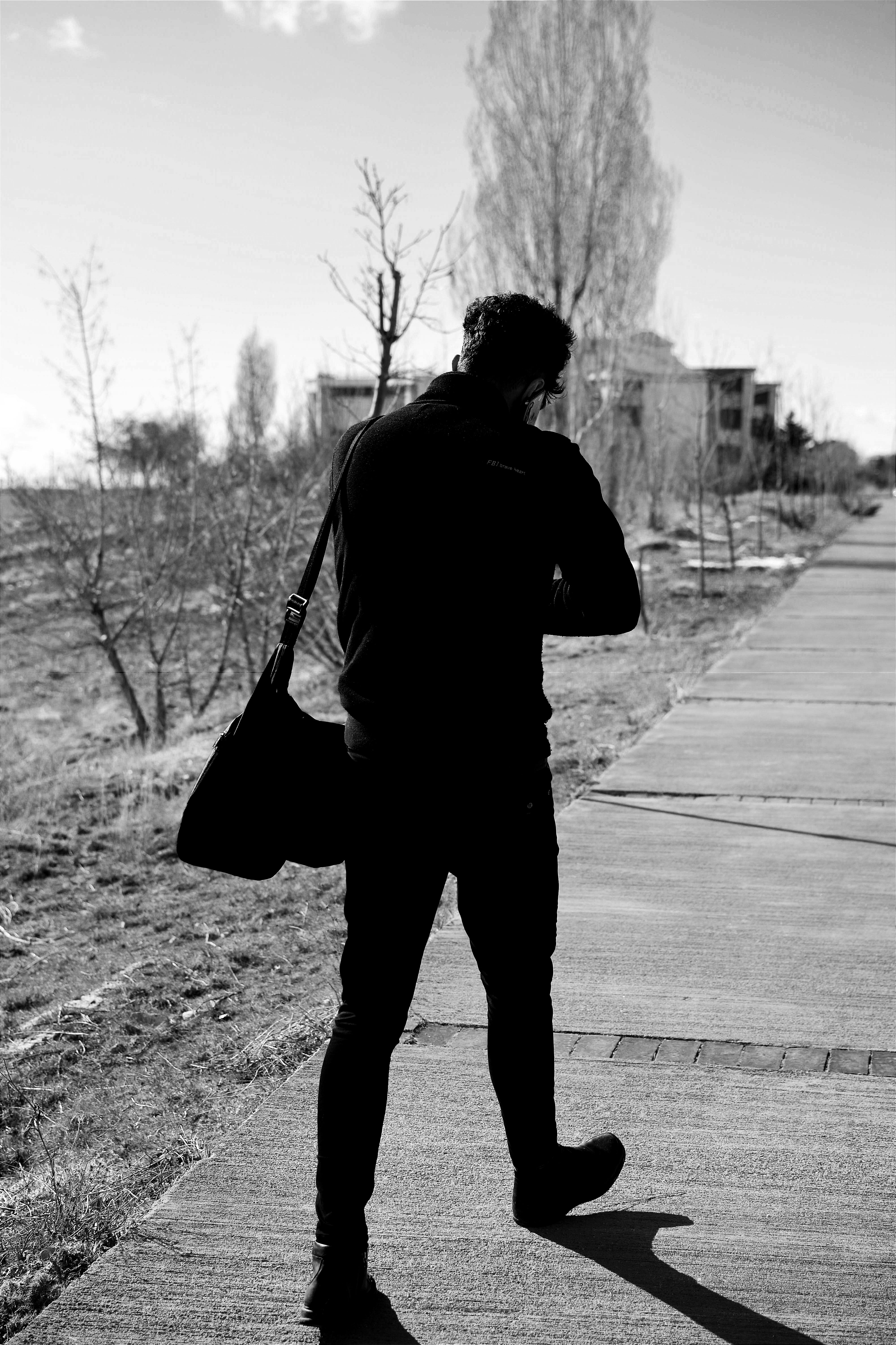 A Man Walking on Street · Free Stock Photo