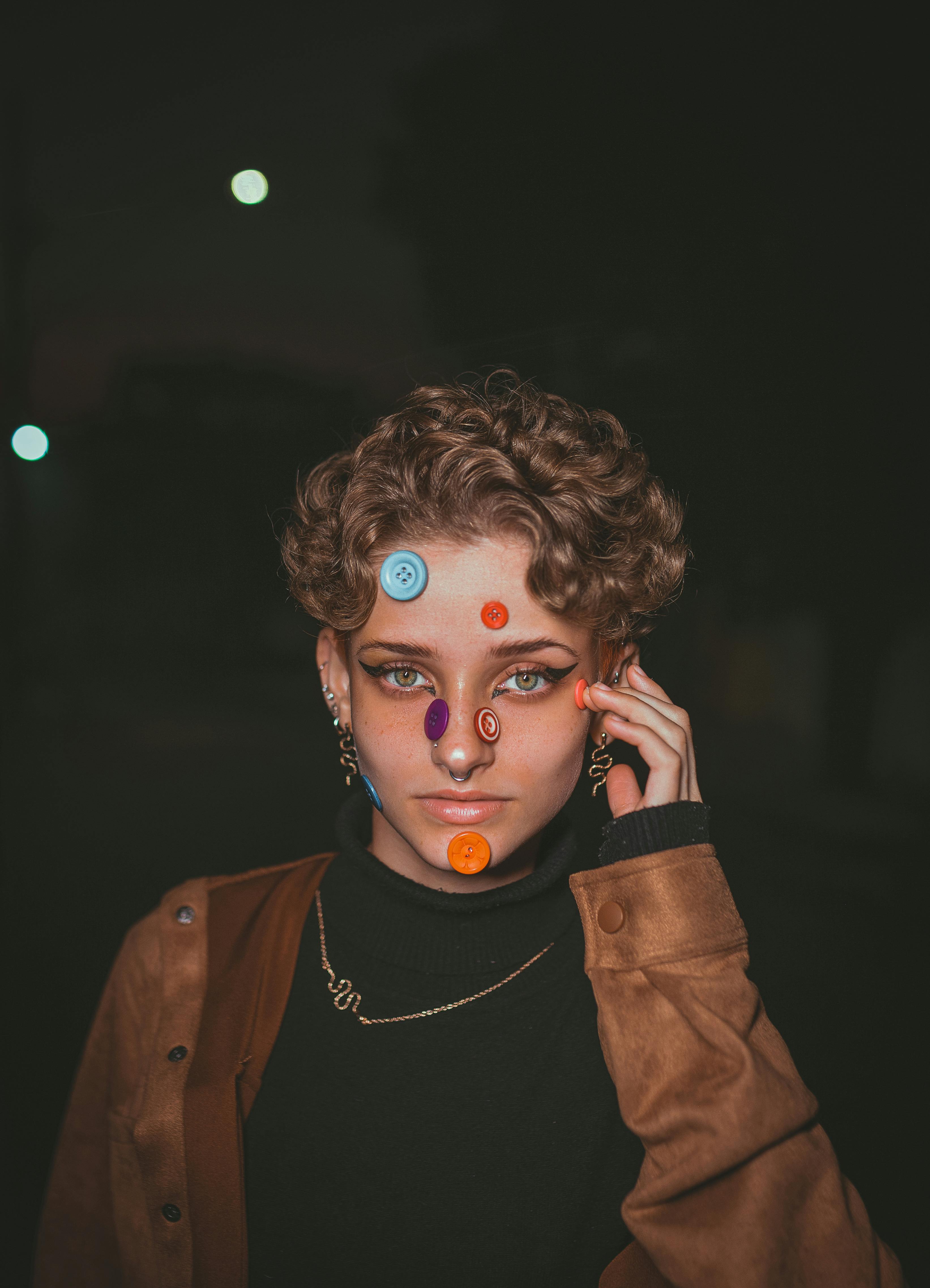 A Woman With Buttons on her Face · Free Stock Photo