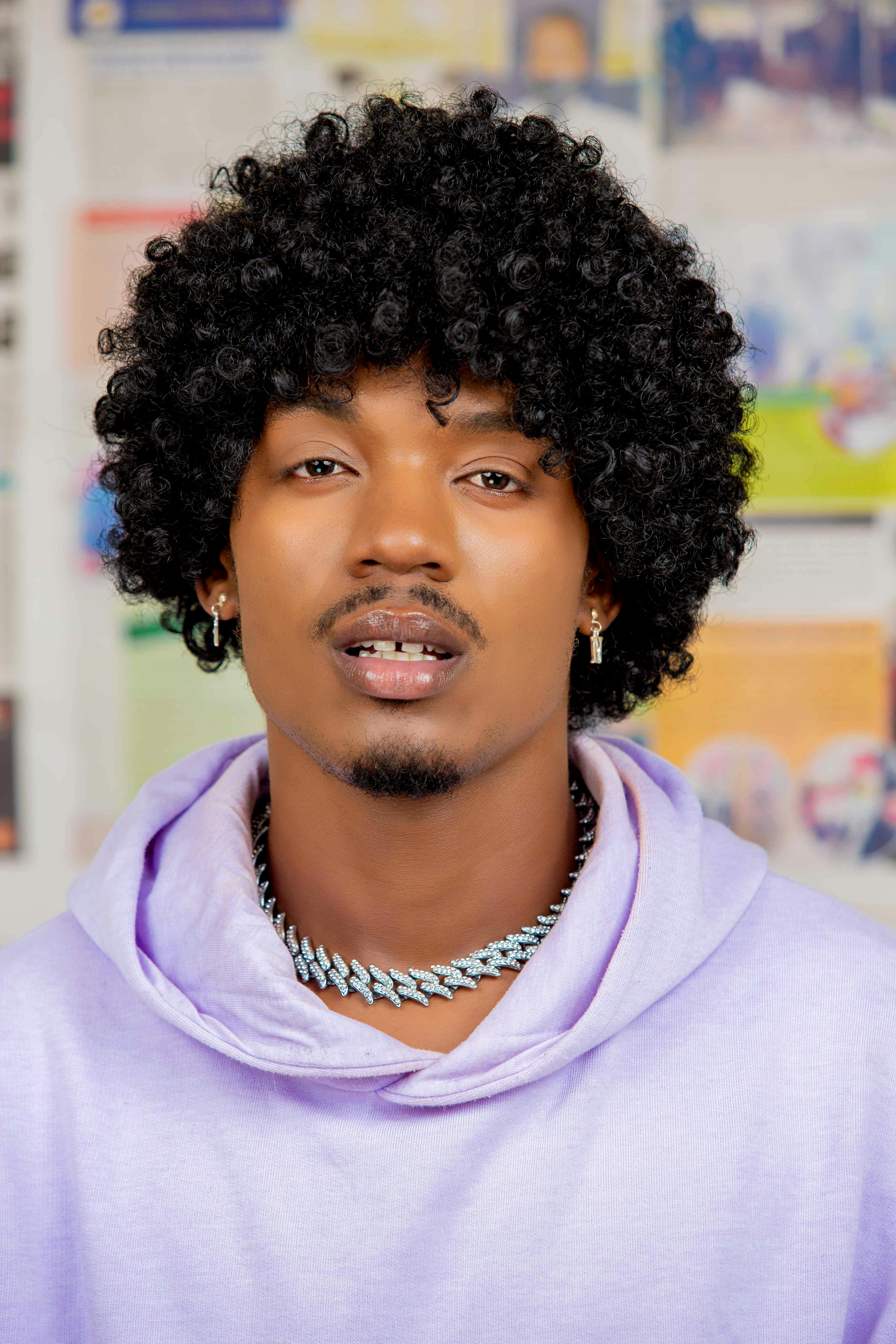 Man With Afro Hair Holding Delicate Flower · Free Stock Photo