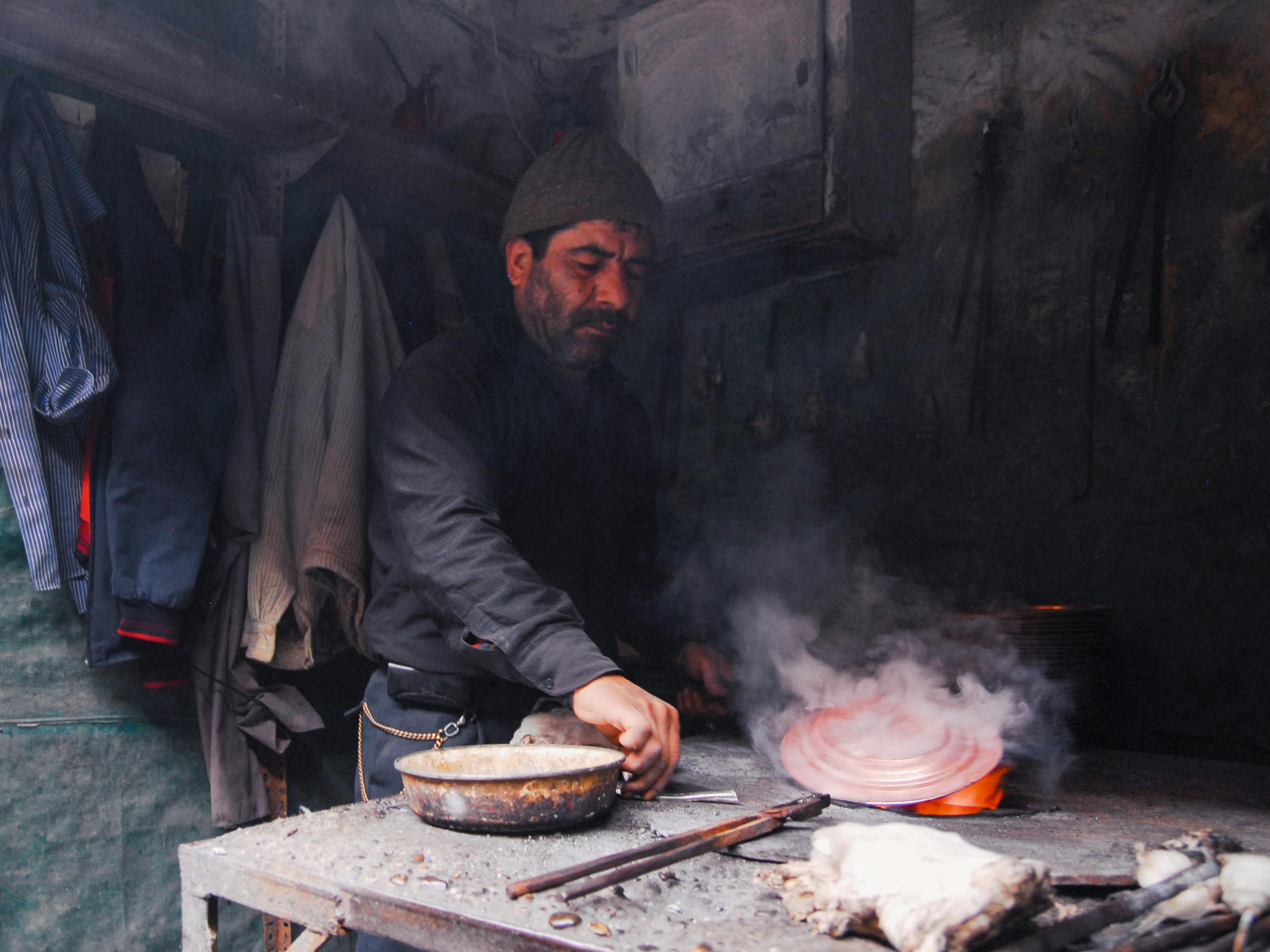 Person Forging a Hot Metal with a Machine · Free Stock Photo