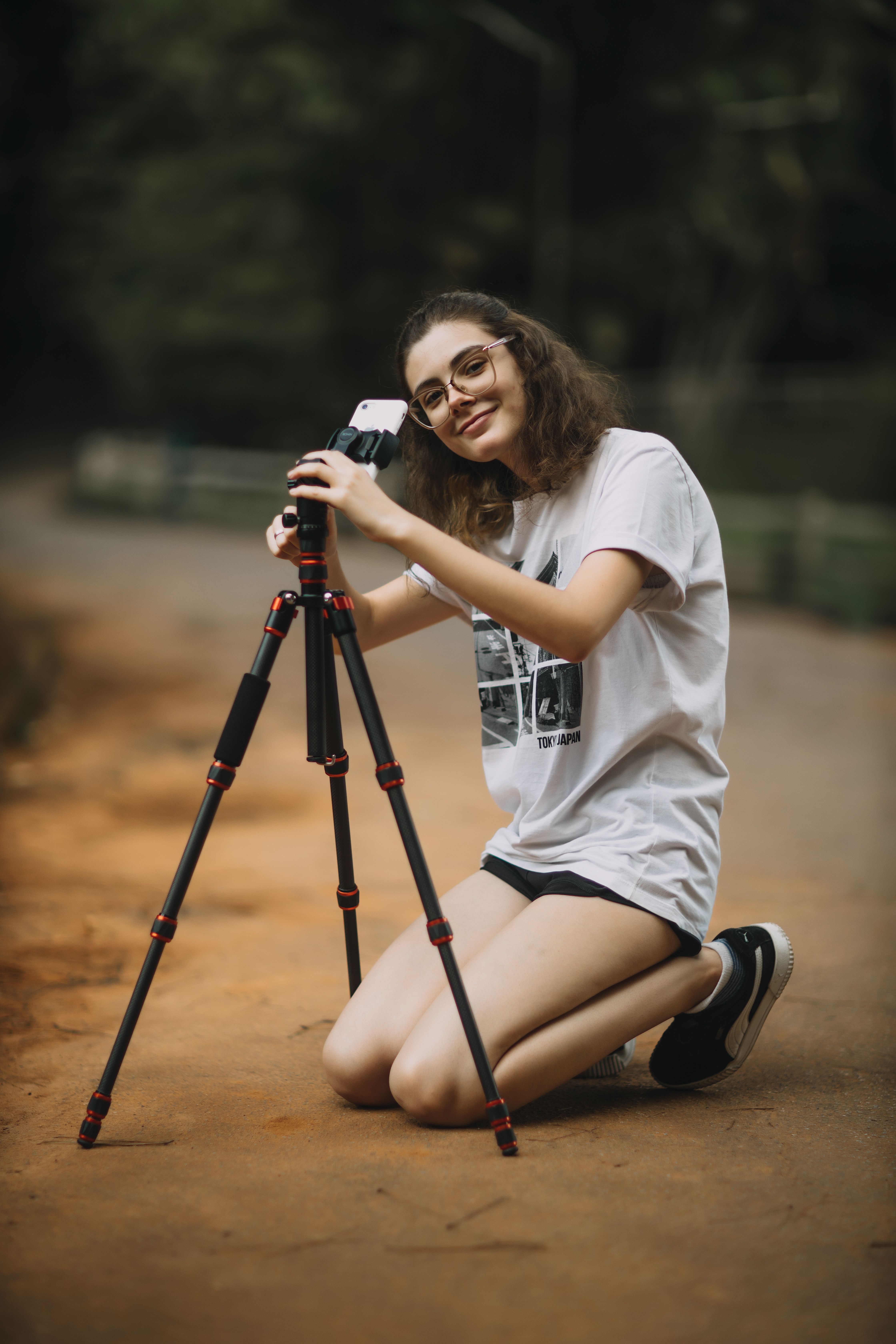 Girl Using Phone With a Tripod · Free Stock Photo