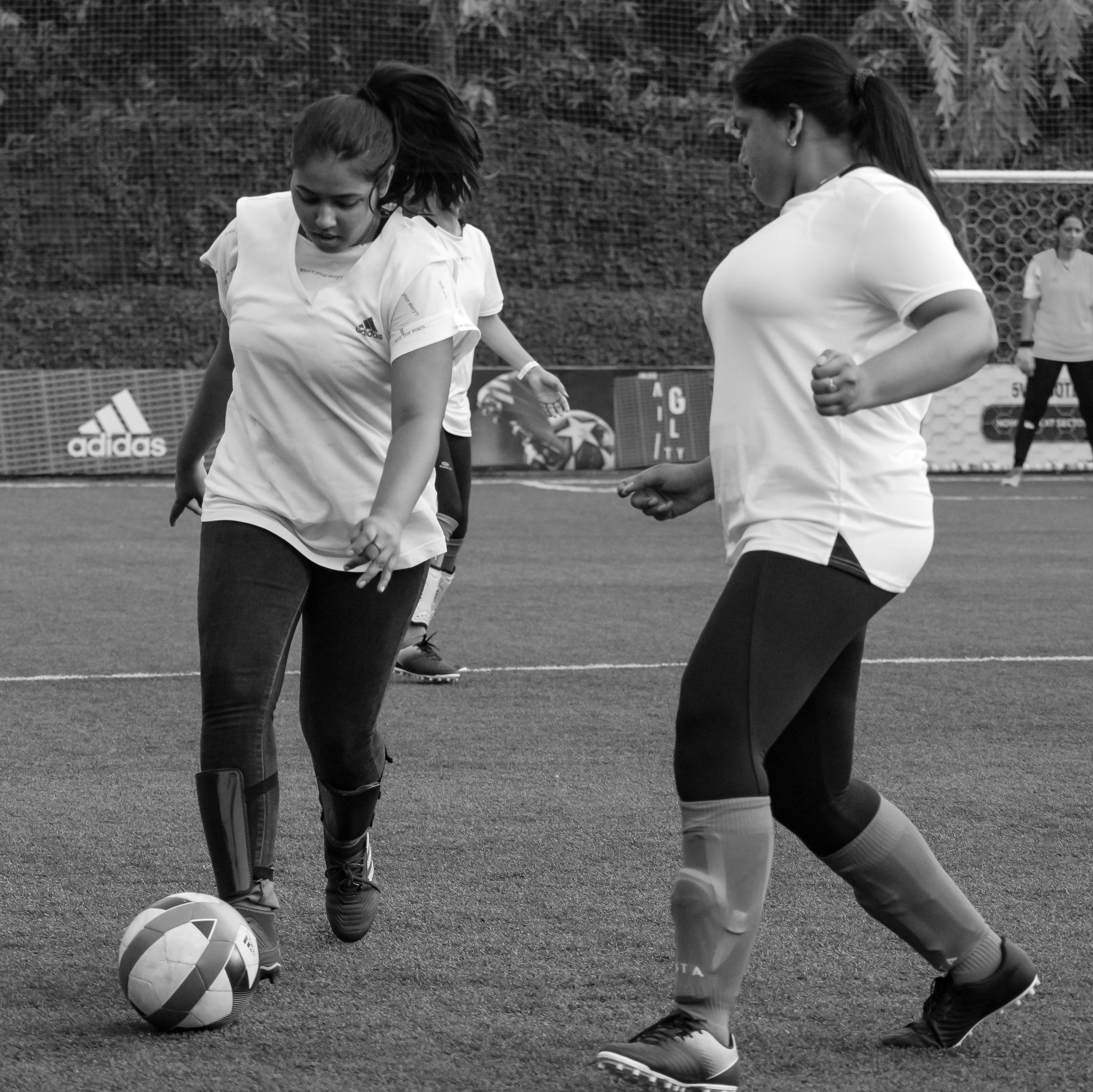 A Grayscale of Football Players on a Field · Free Stock Photo