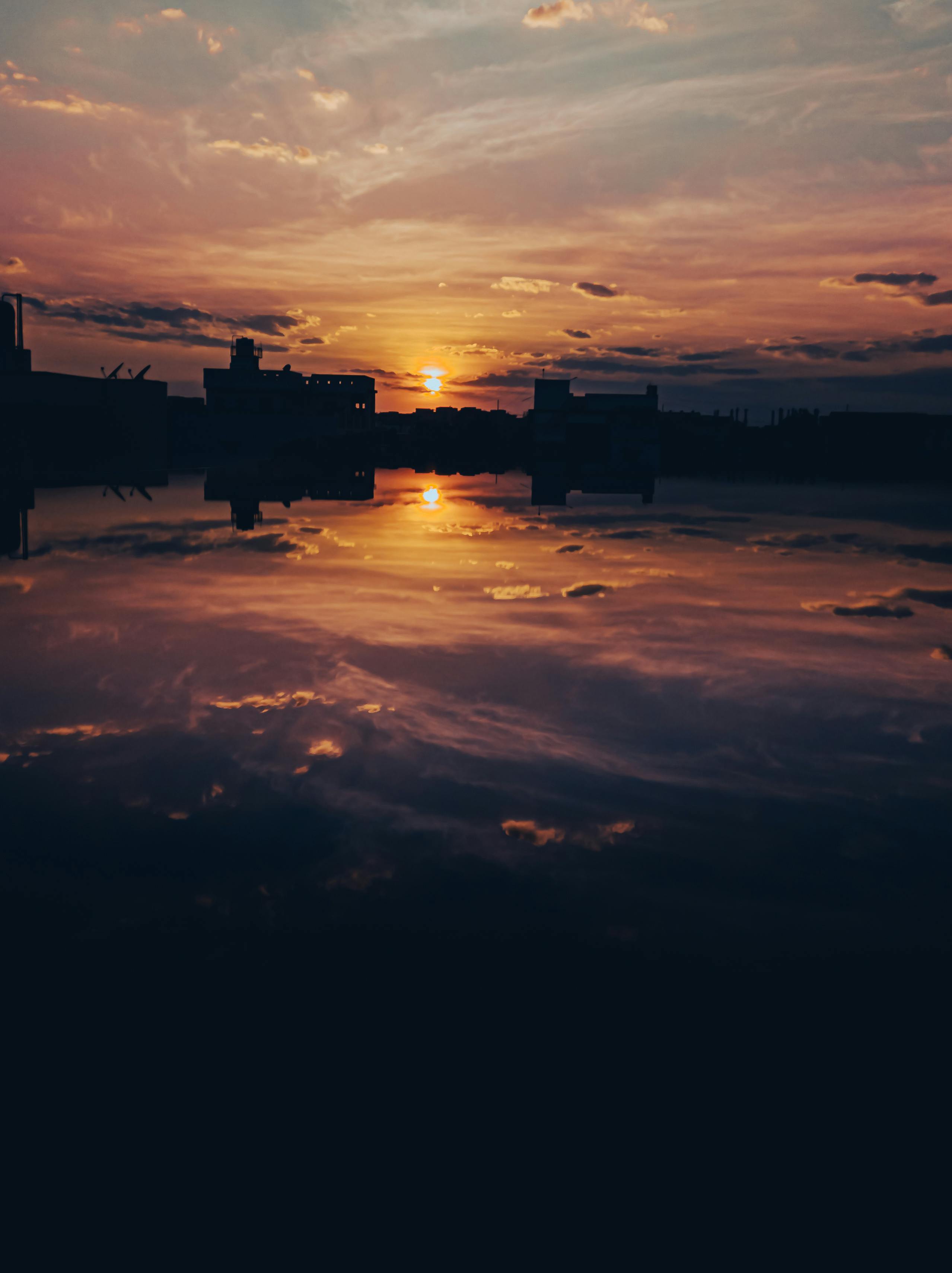 Sunset Reflection over Water Surface · Free Stock Photo