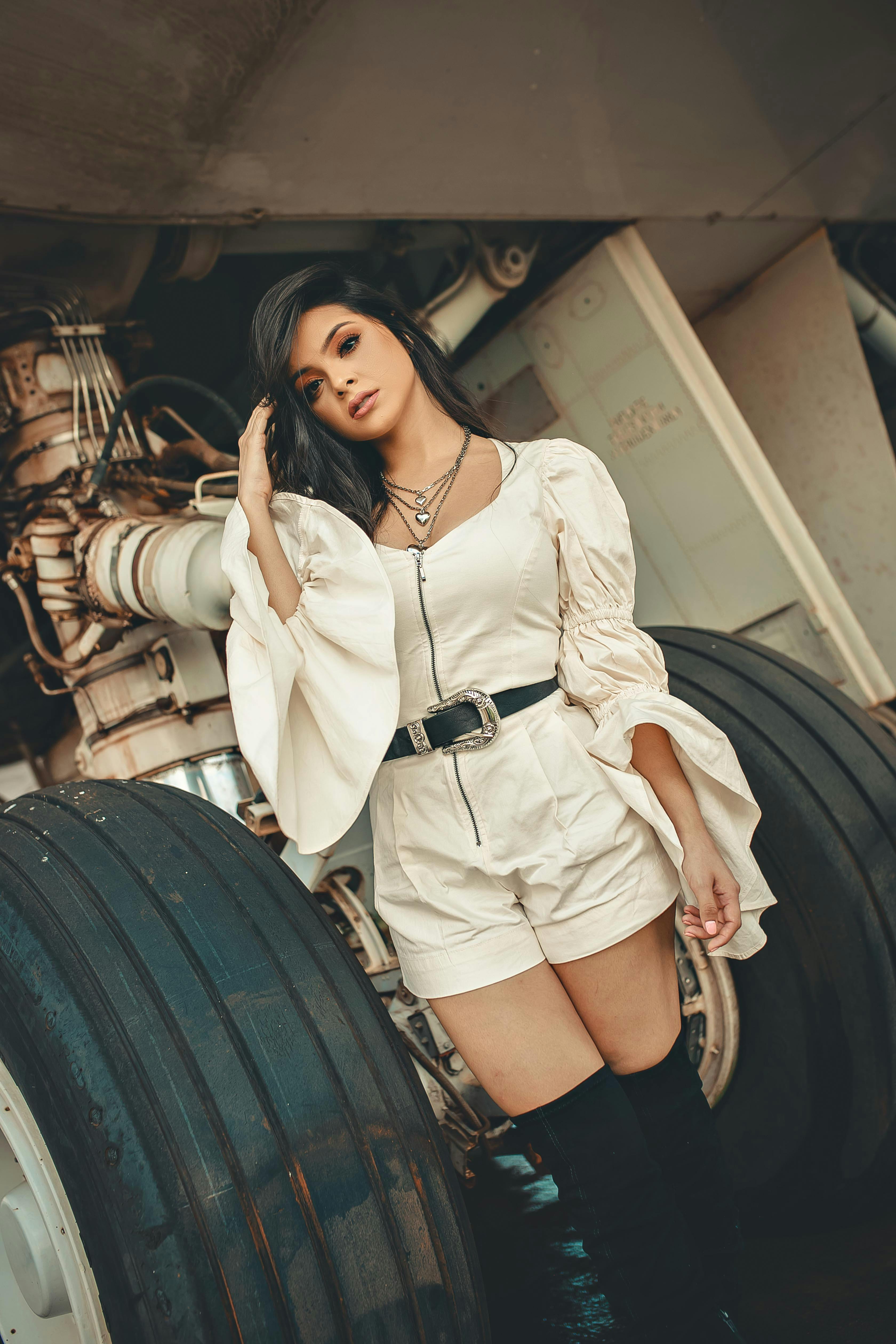 Model Posing in Denim Shorts and Boots · Free Stock Photo