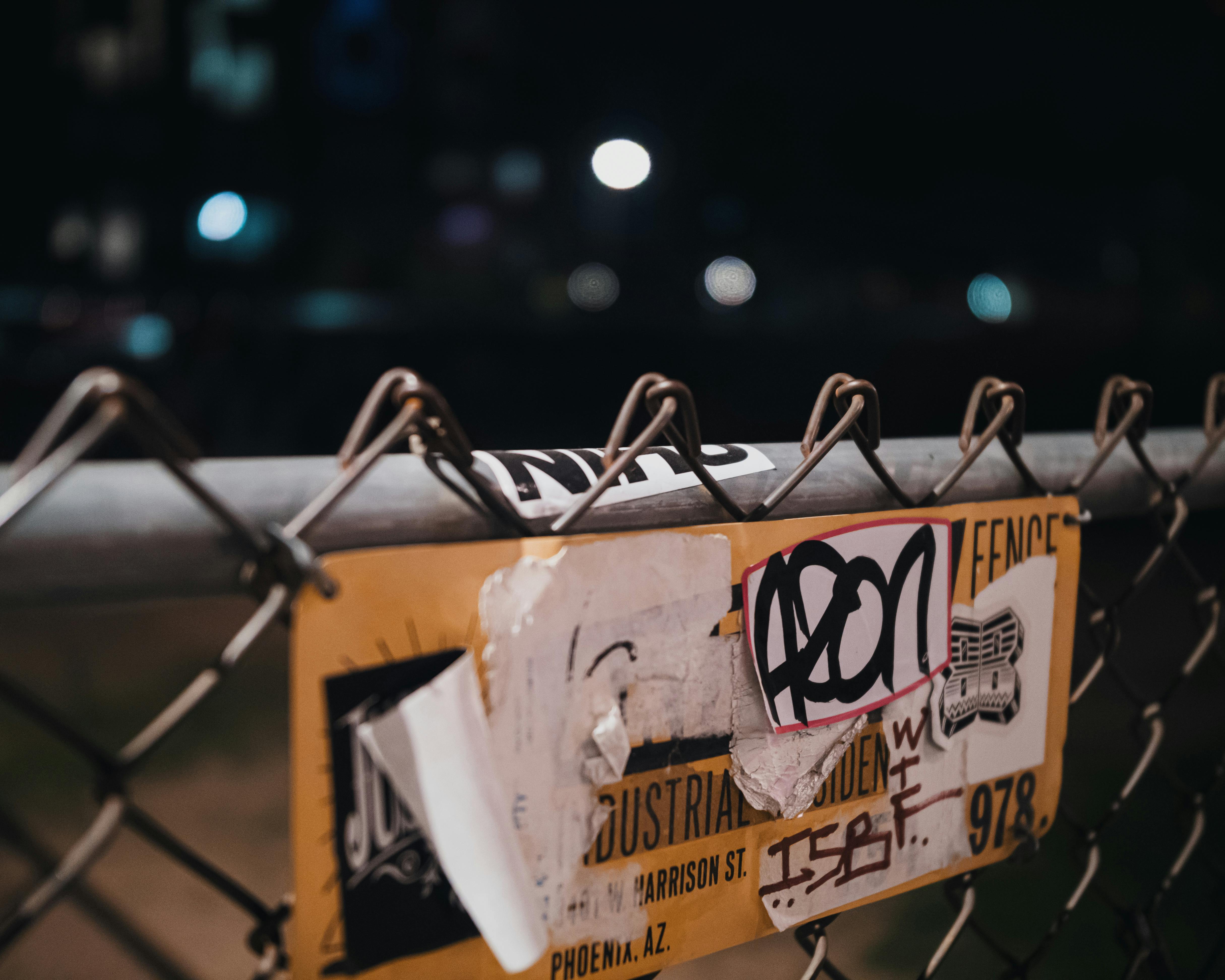 Close-up of the Danger Signage on the Metal Fence · Free Stock Photo