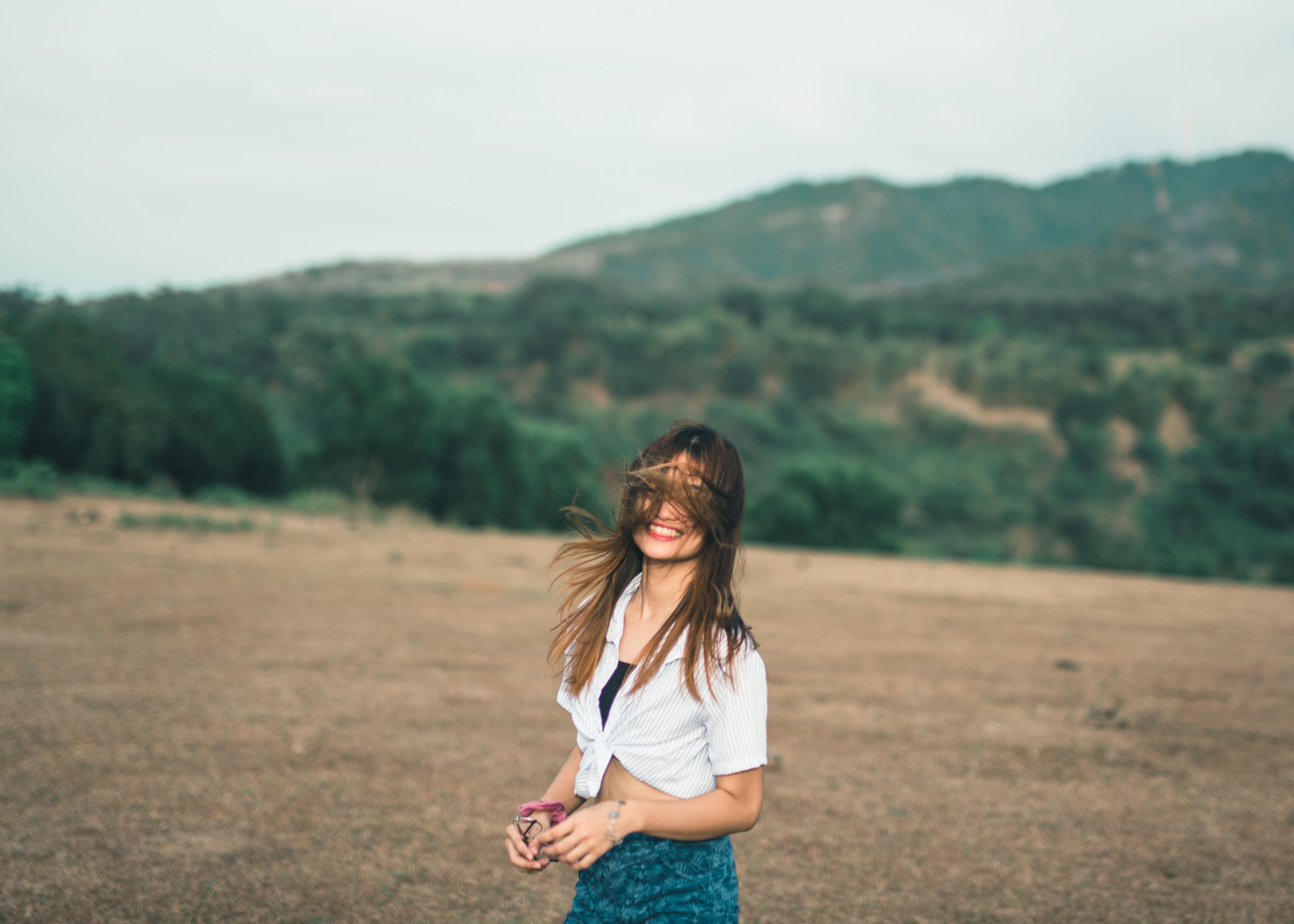 A Woman Standing with Arms Wide Open · Free Stock Photo