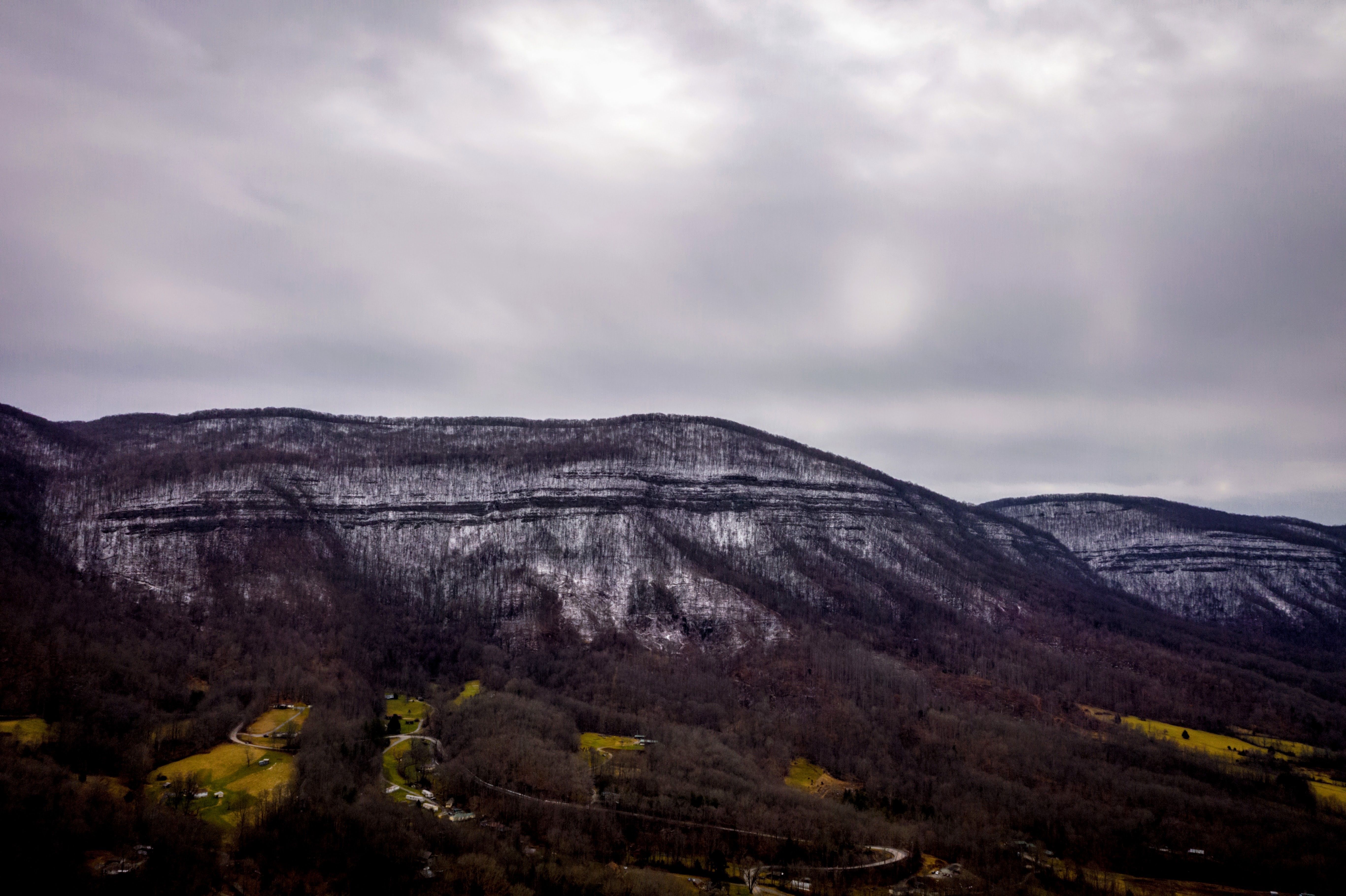 Gray Mountains Under White Cloudy Sky · Free Stock Photo